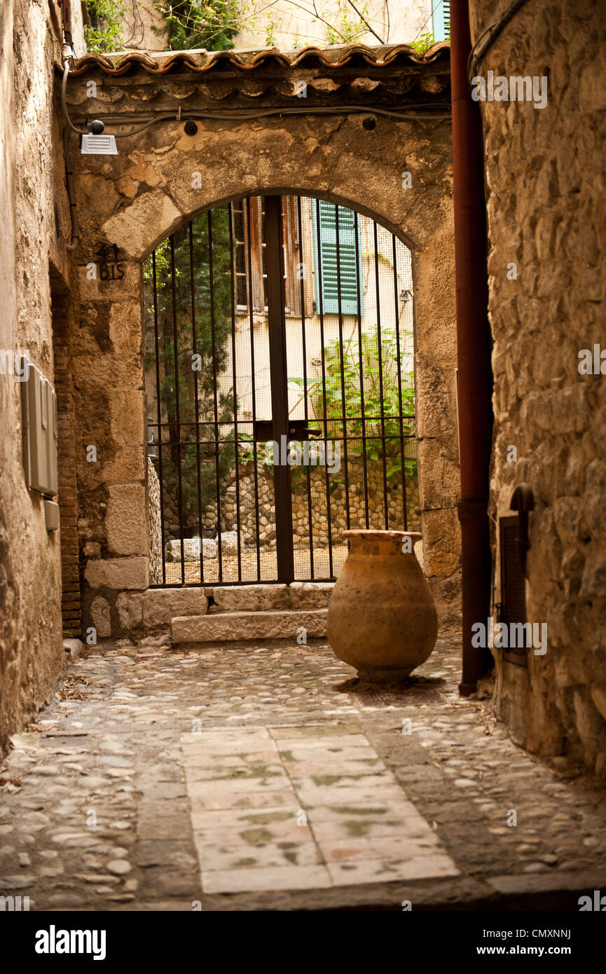 A cross gate up a walking path in Saint-Paul, France Stock Photo - Alamy