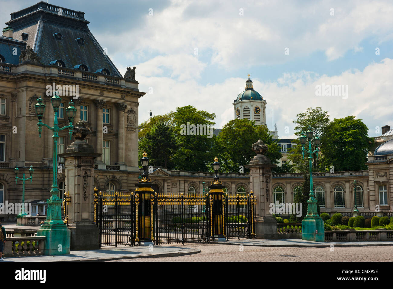 The rich gold and black gates on the side in front of the Royal Palace ...