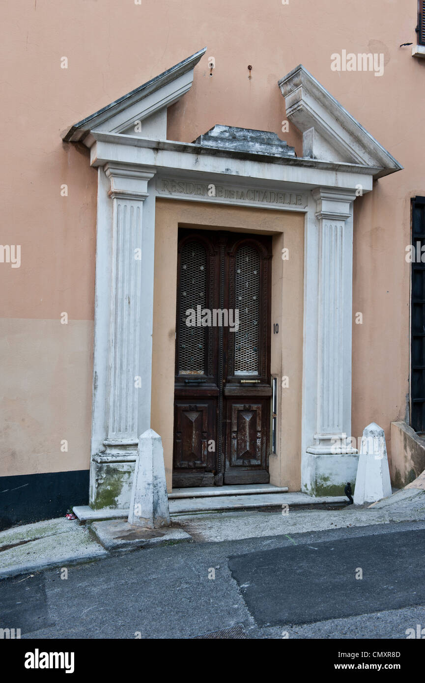 An old brown door of a tan building Stock Photo - Alamy