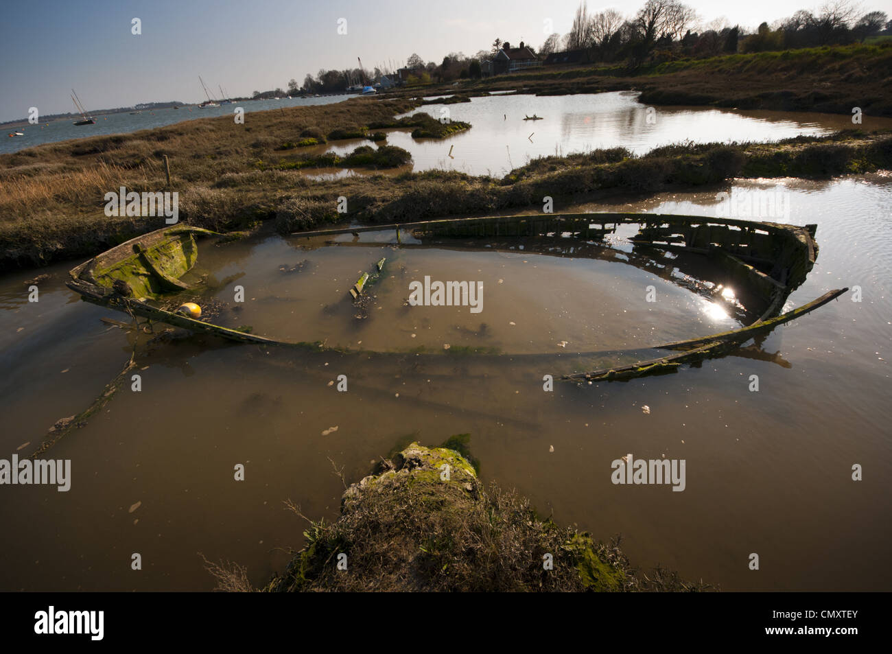 Wreck of wooden boat in mud Stock Photo - Alamy