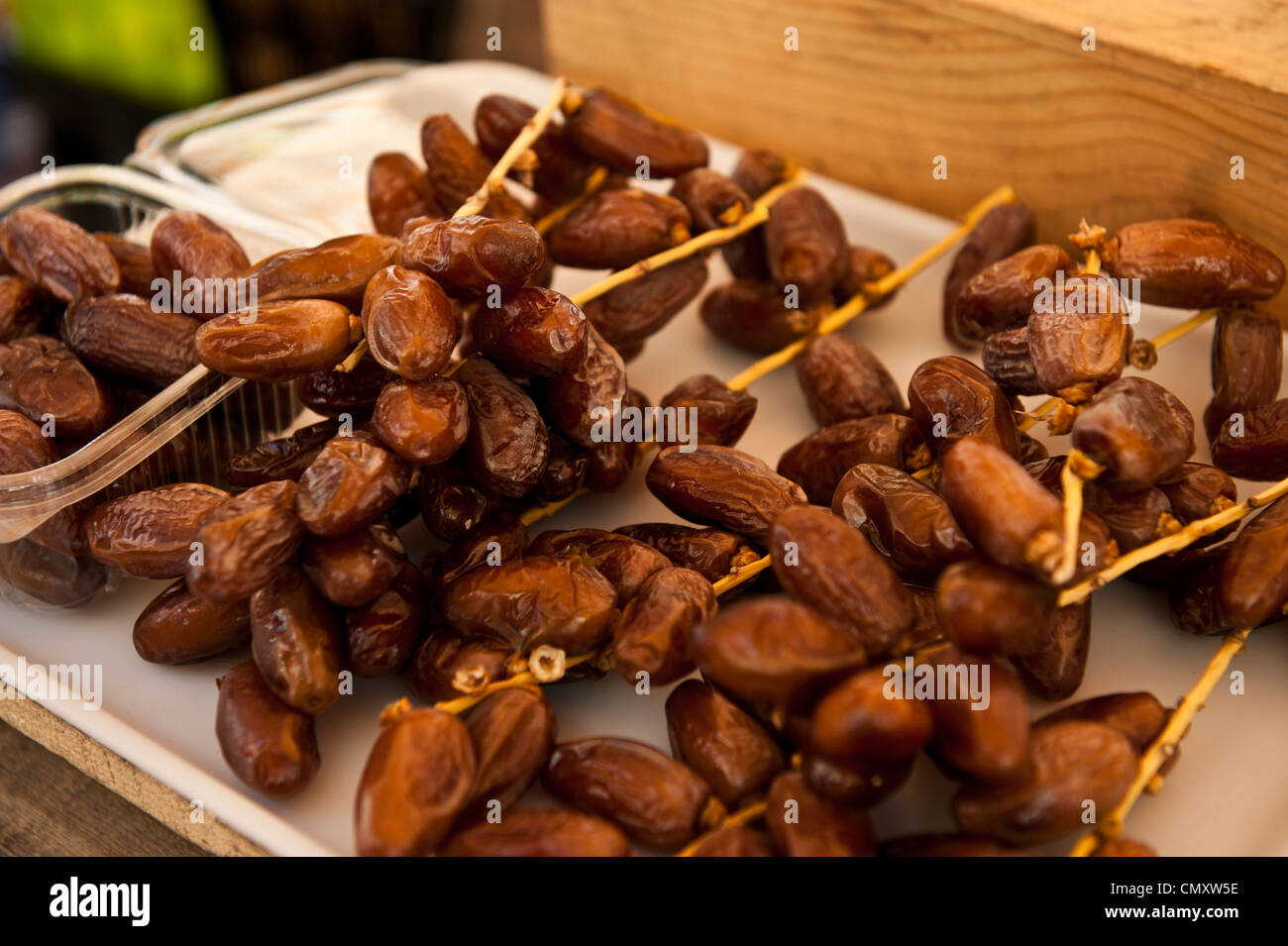 Dates on a stick scattered across a serving tray Stock Photo - Alamy