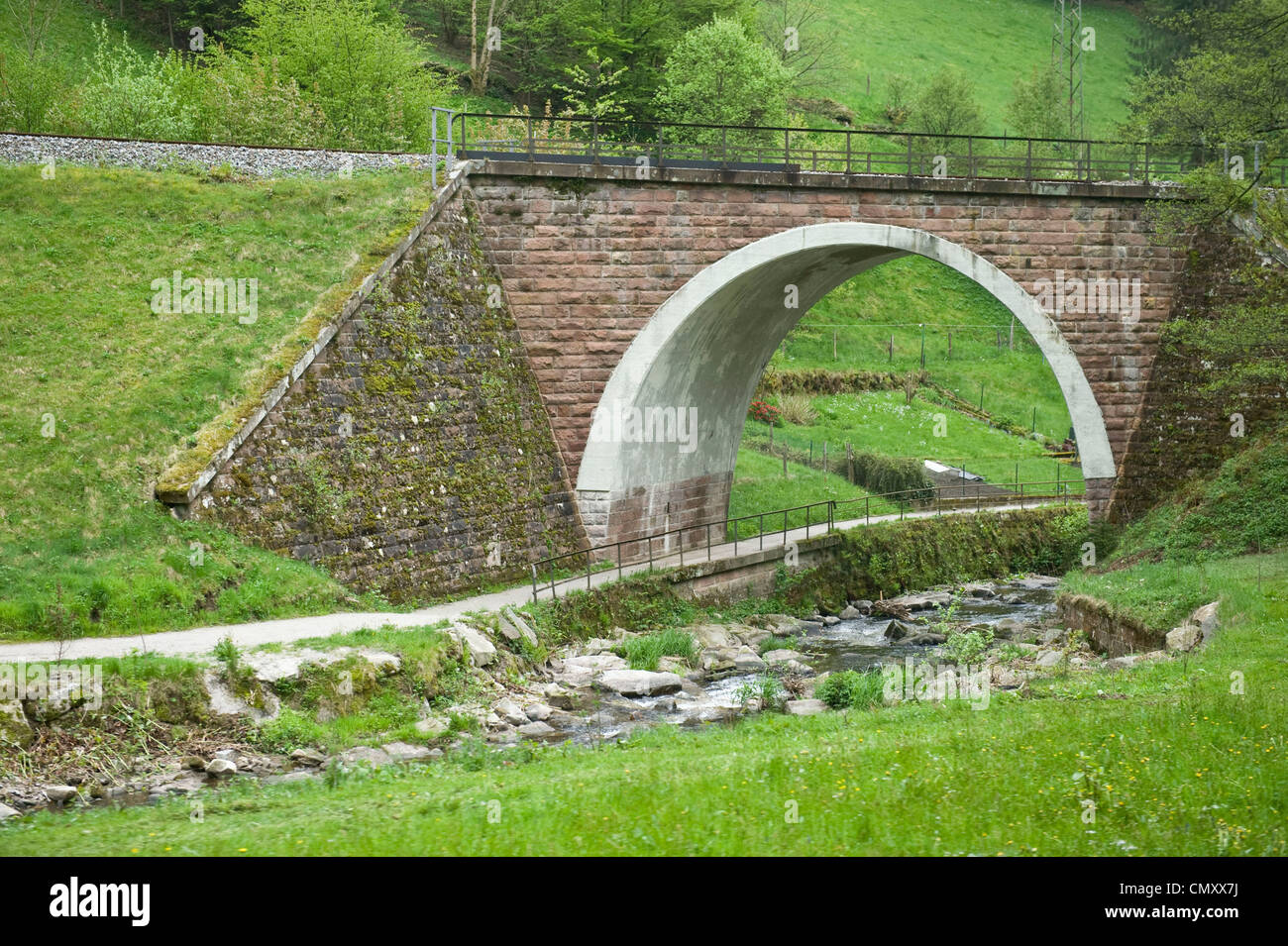 A cool focused shot of a brick bridge with moss growing on it ...
