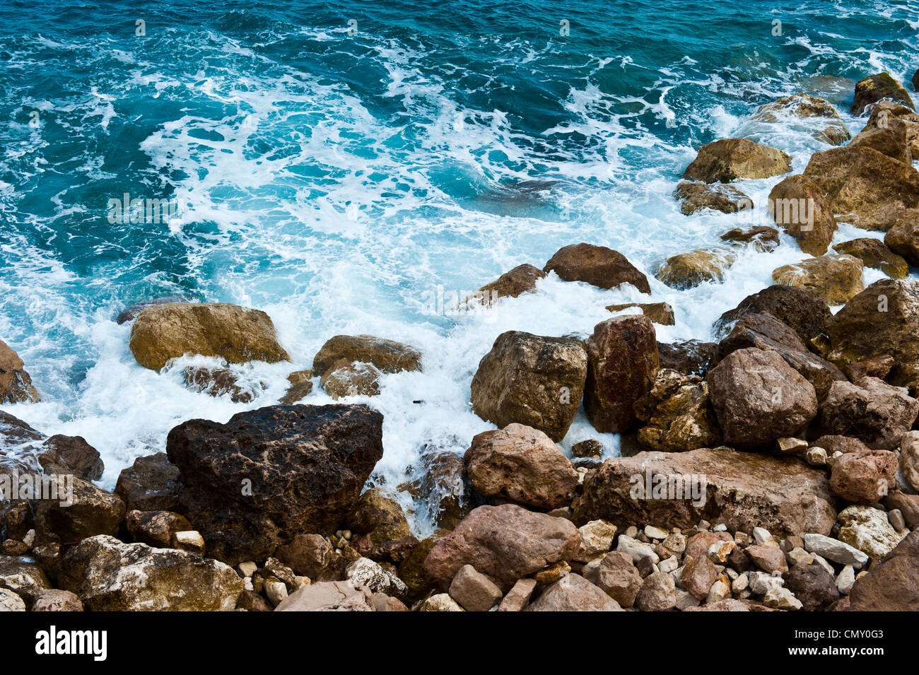 Water splashing on rocks in the sea Stock Photo - Alamy