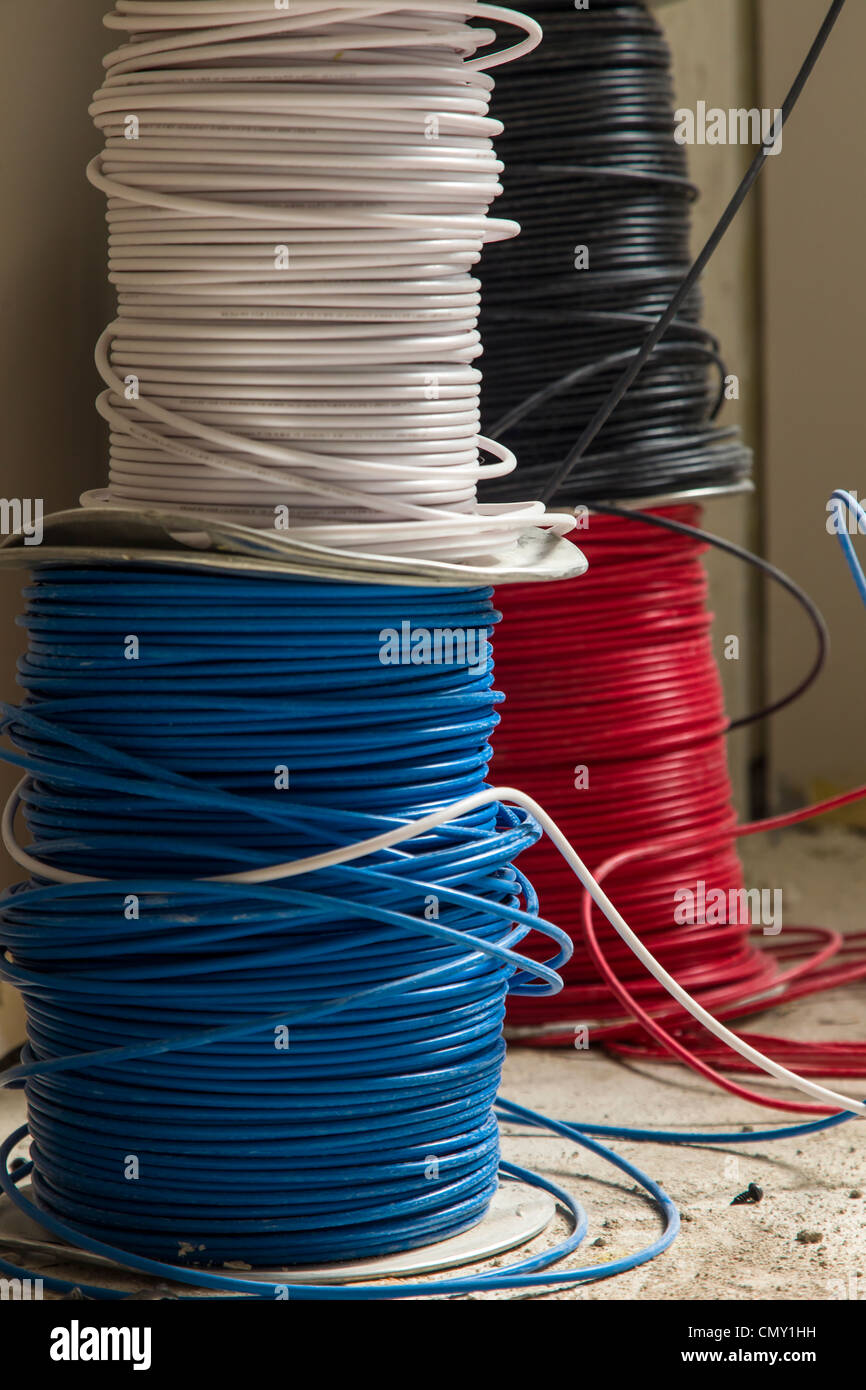 Rolls of cable on construction site Stock Photo - Alamy