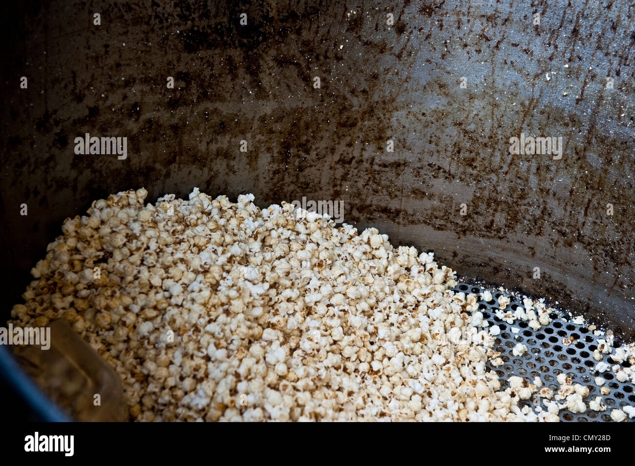Preparing pop corn in a big, silver pot Stock Photo - Alamy