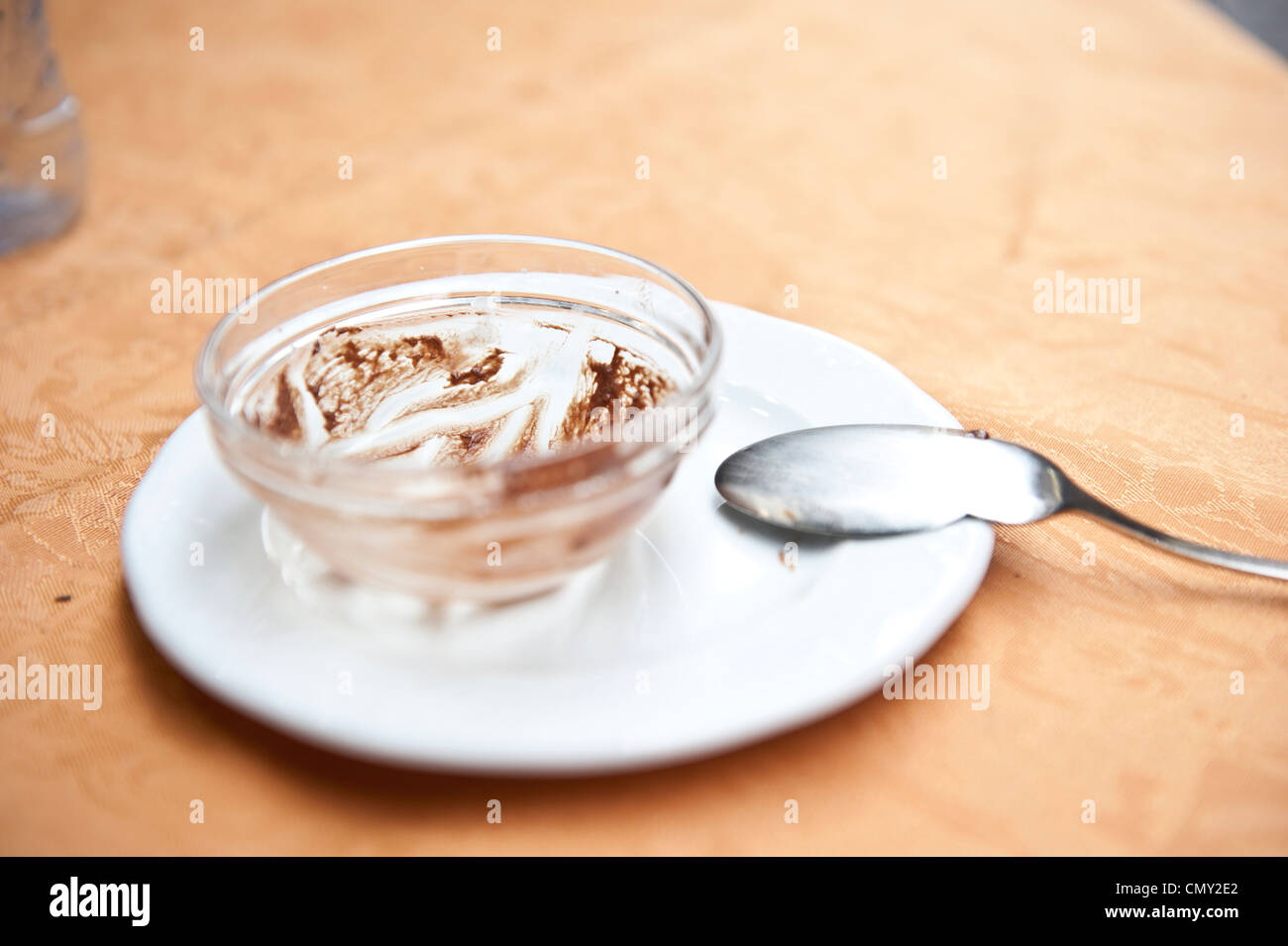 Spoon sitting on the plate of a finished chocolate fudge dessert Stock ...