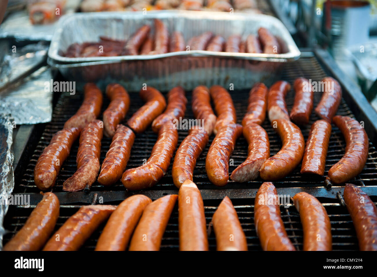 Rows of greasy hot dogs on grill Stock Photo - Alamy