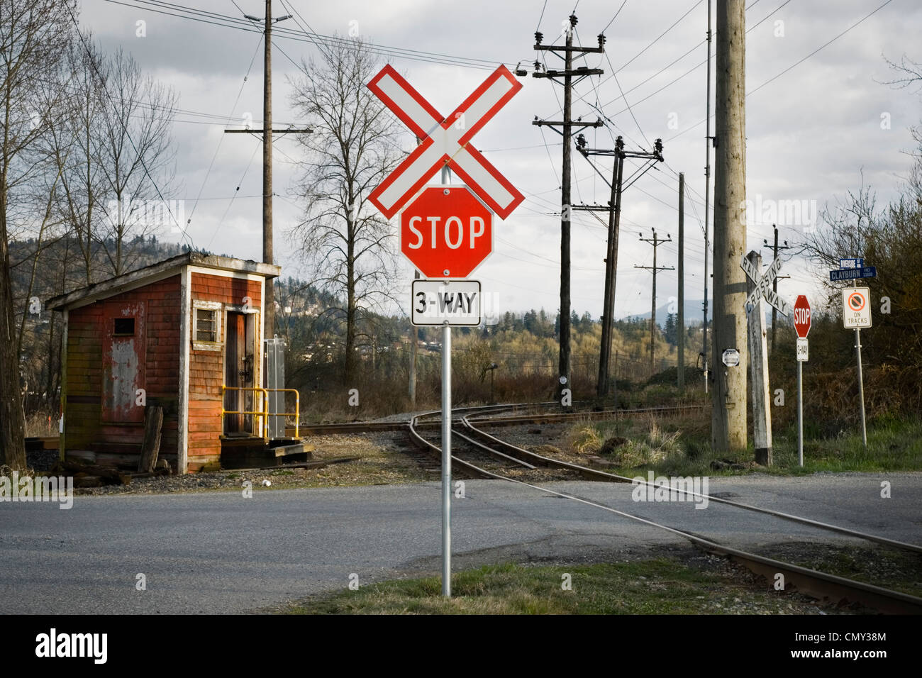 Railroad maintenance shed,and traffic signs at a railway crossing ...