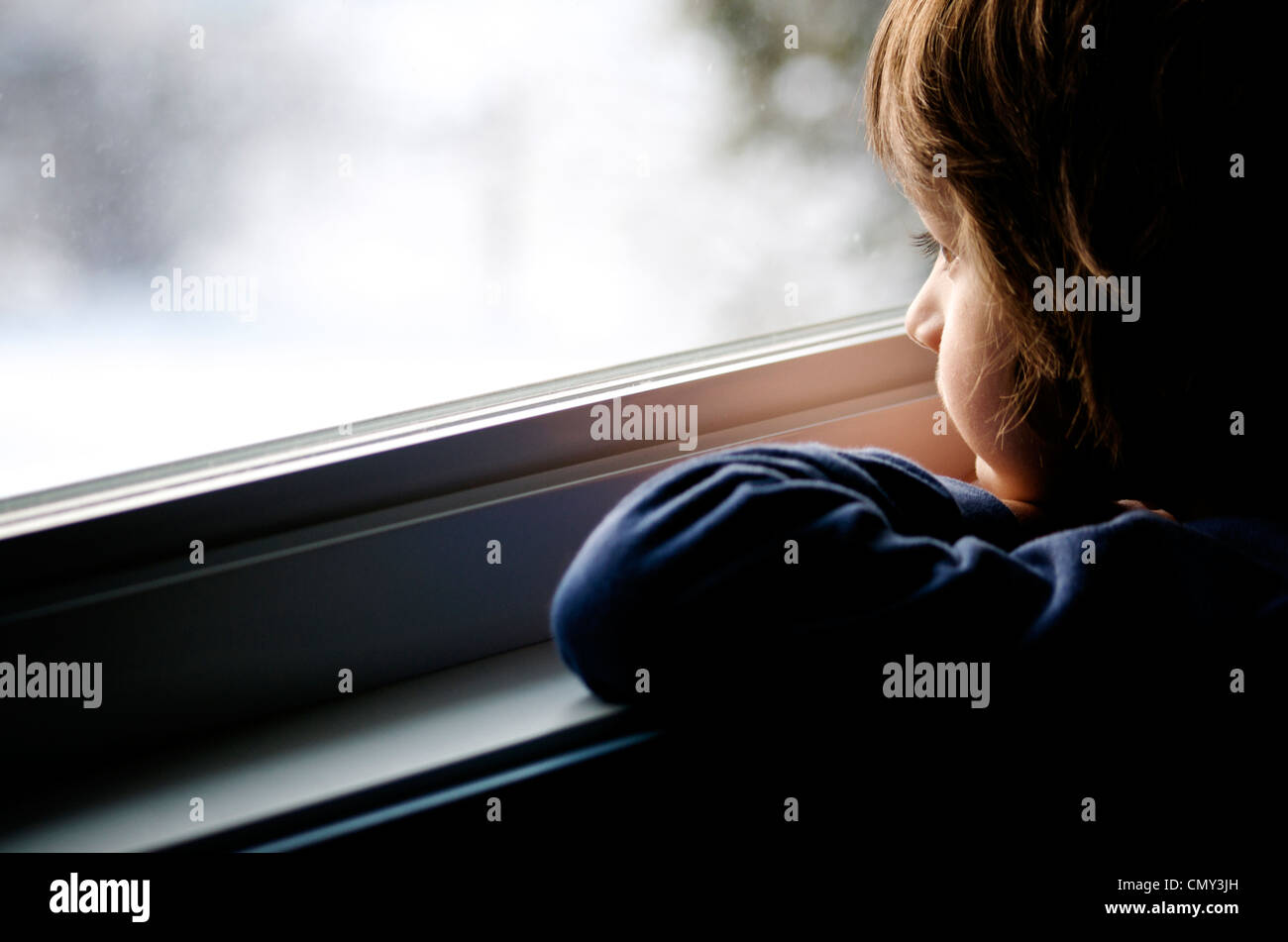 Profile of a young boy looking out a window, Otterburn Park, Quebec ...
