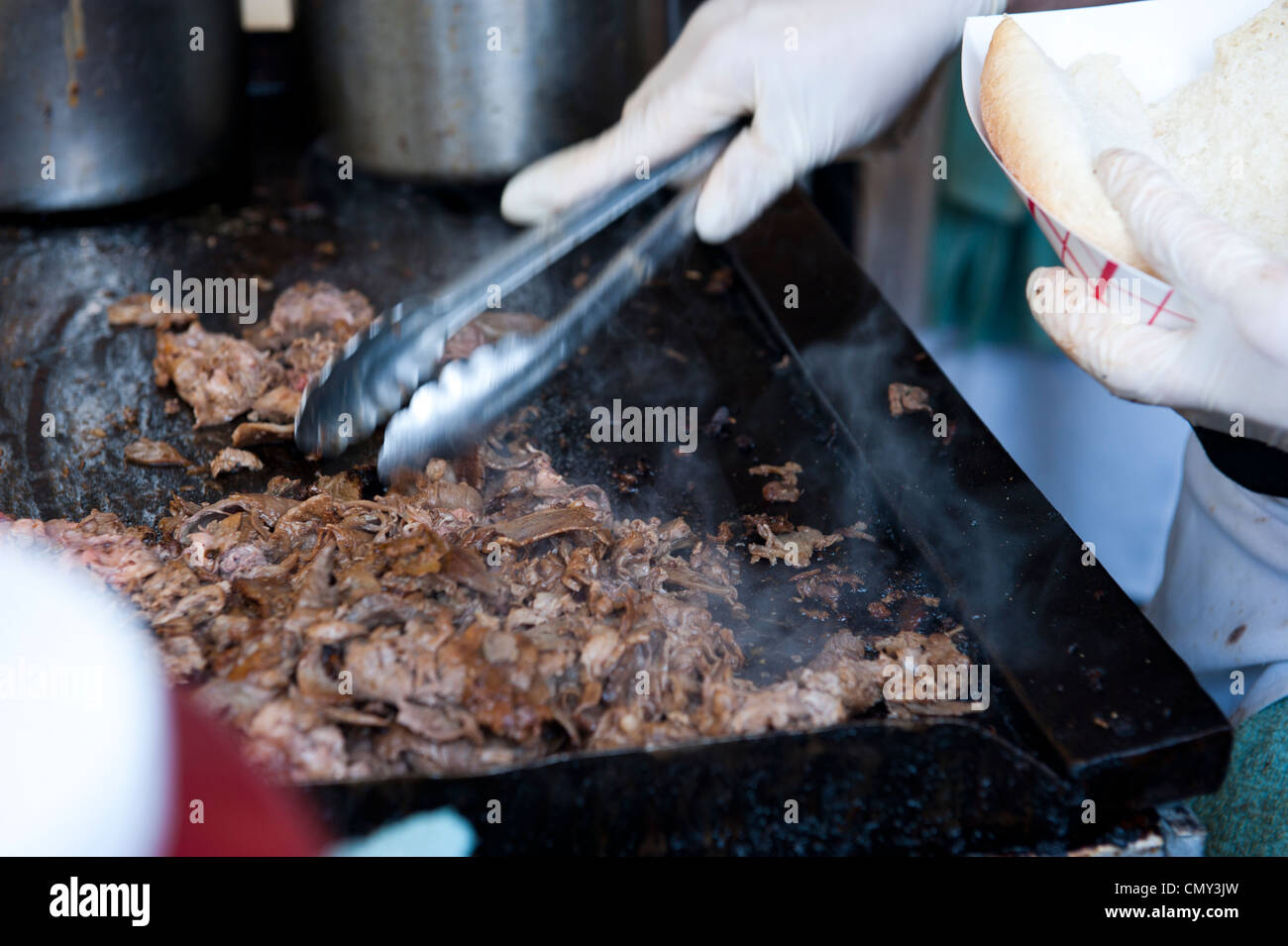 A chef preparing chopped up steak Stock Photo - Alamy