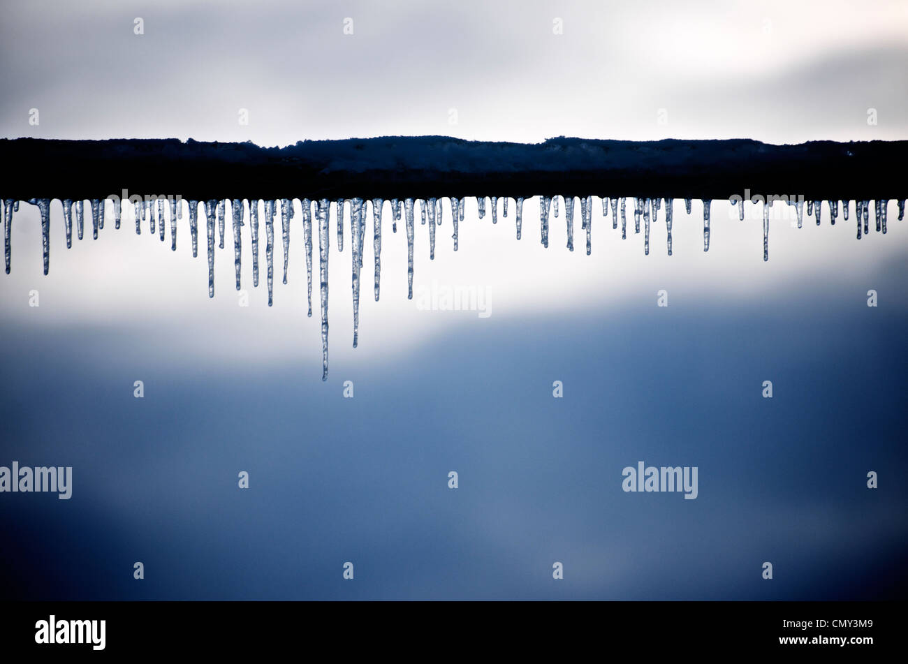 Icicles and snow on a telephone wire just before sunset, Otterburn Park ...
