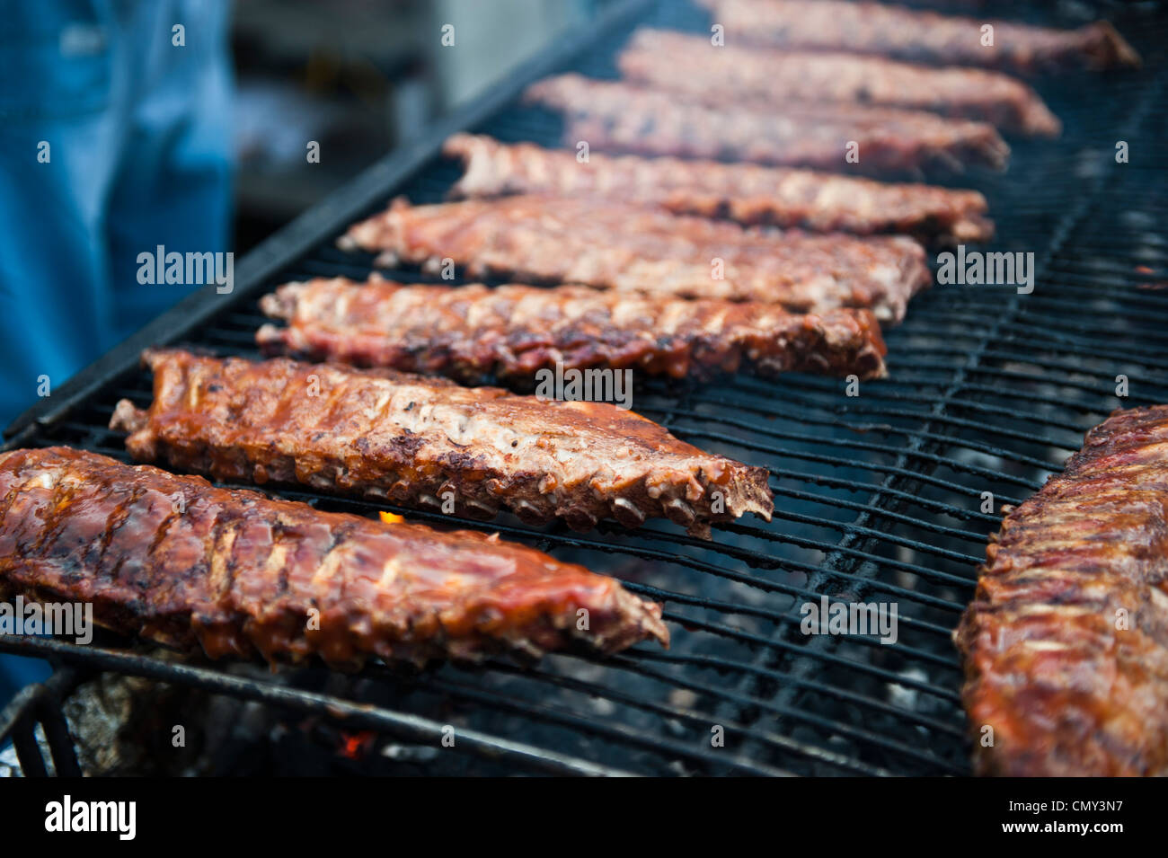 A side shot of a row of slabs of ribs Stock Photo - Alamy