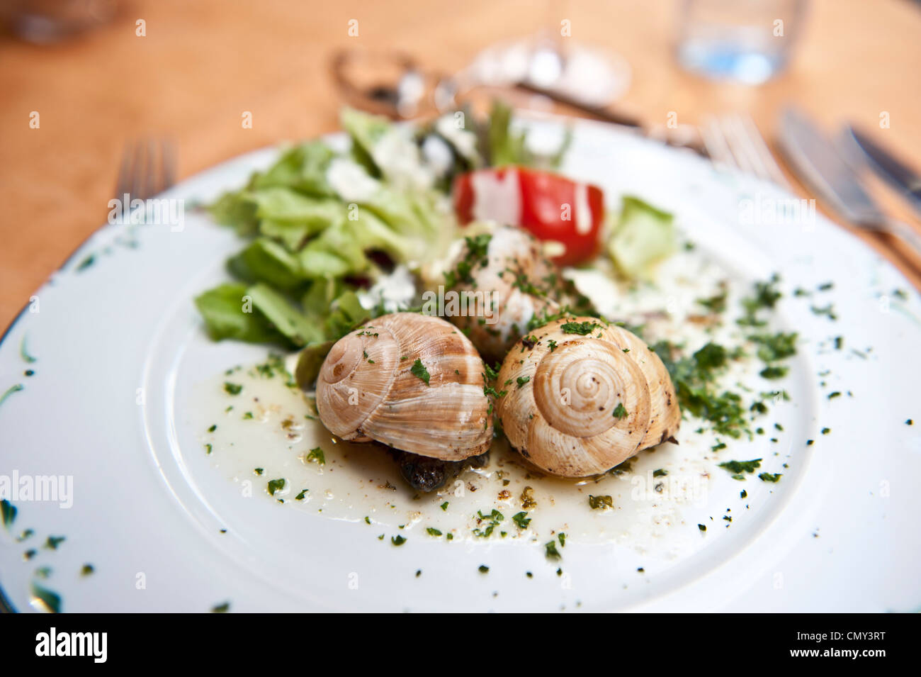 A fresh plate of snail at a formal dining restaurant Stock Photo - Alamy