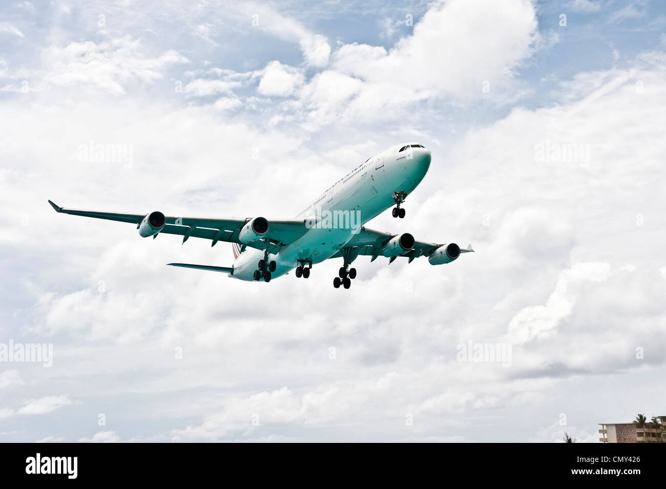 A large airplane landing on a remote island for a vacation Stock Photo ...