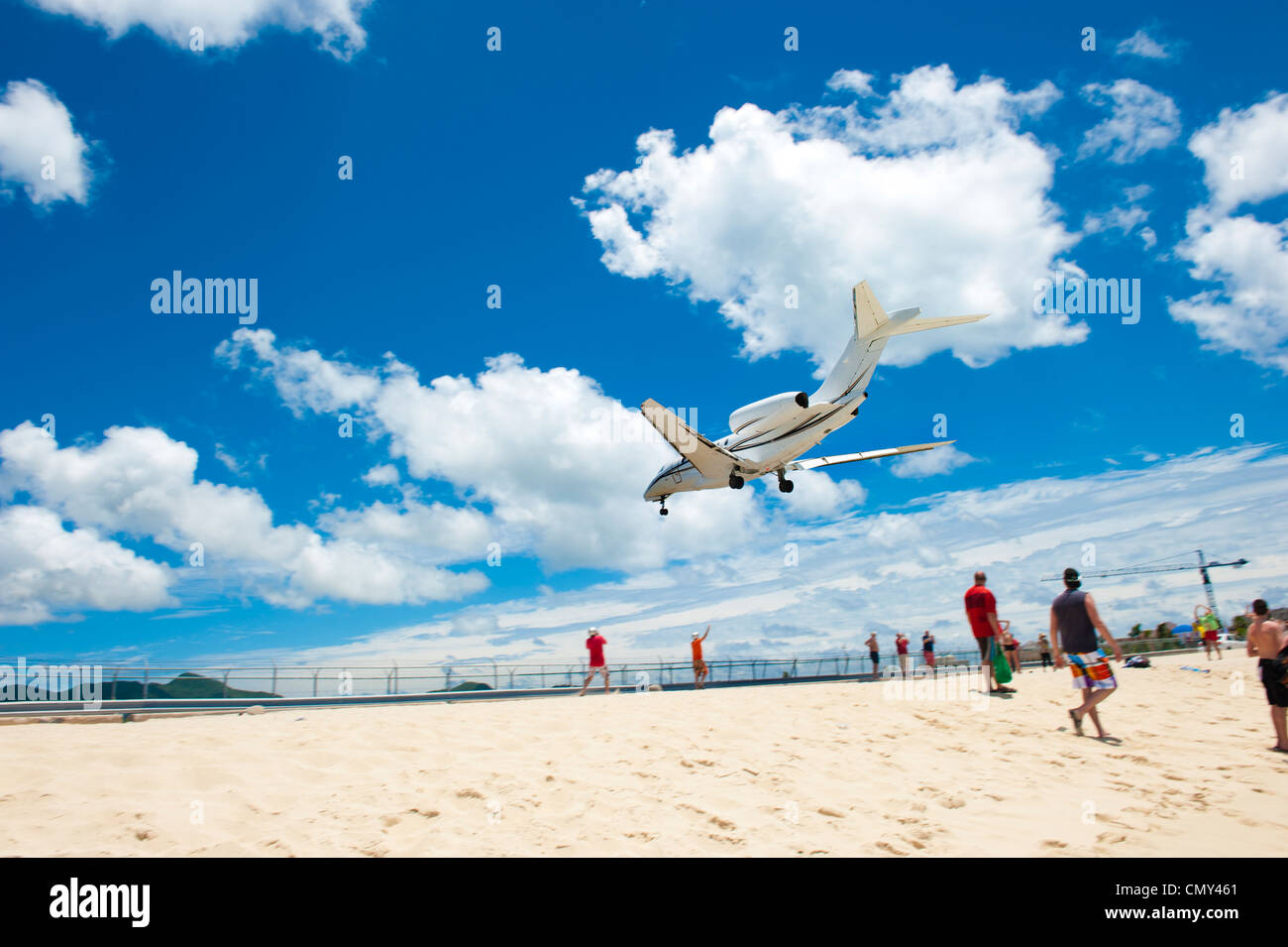 A large airplane landing on a remote island for a vacation Stock Photo ...