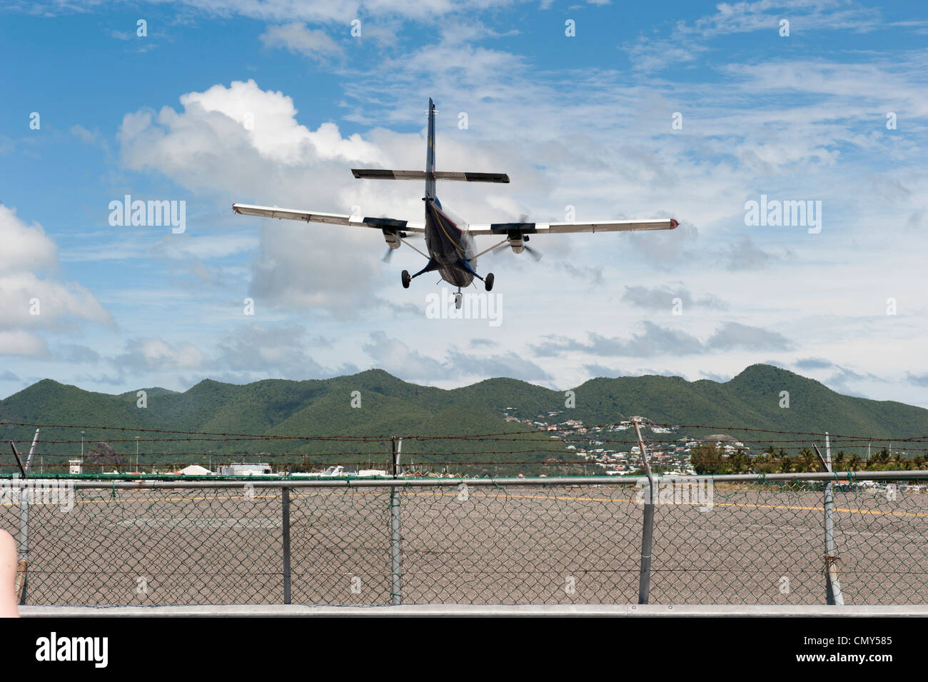 A large airplane landing on a remote island for a vacation Stock Photo ...