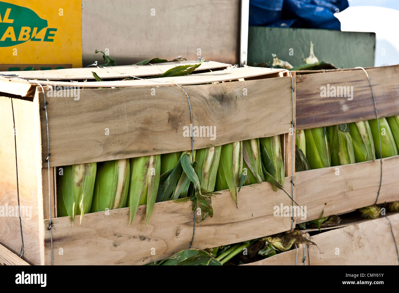 Tightly package corn in wooden boxes outside of a food market Stock ...