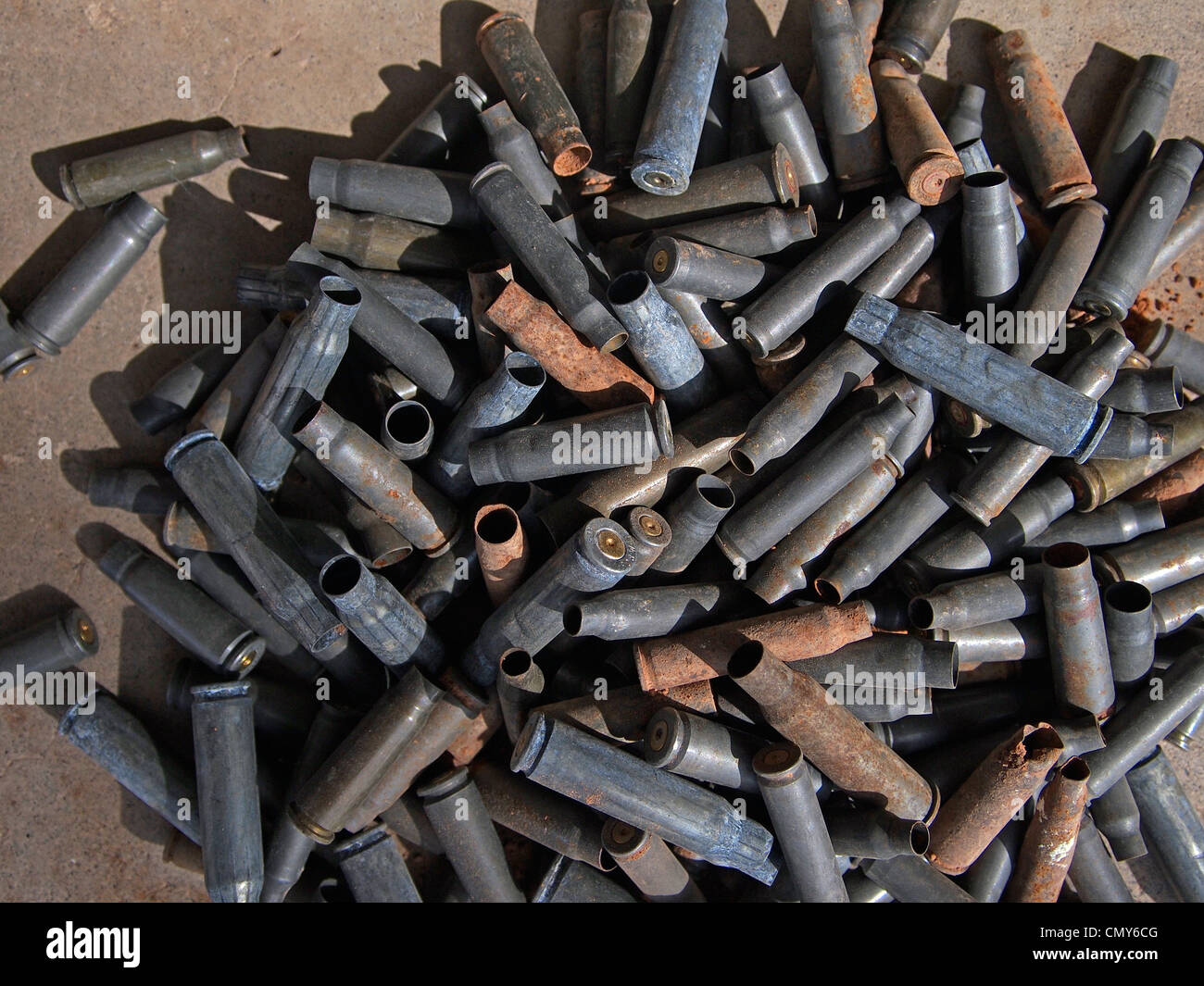 A pile of used steel rifle shell casings Stock Photo - Alamy