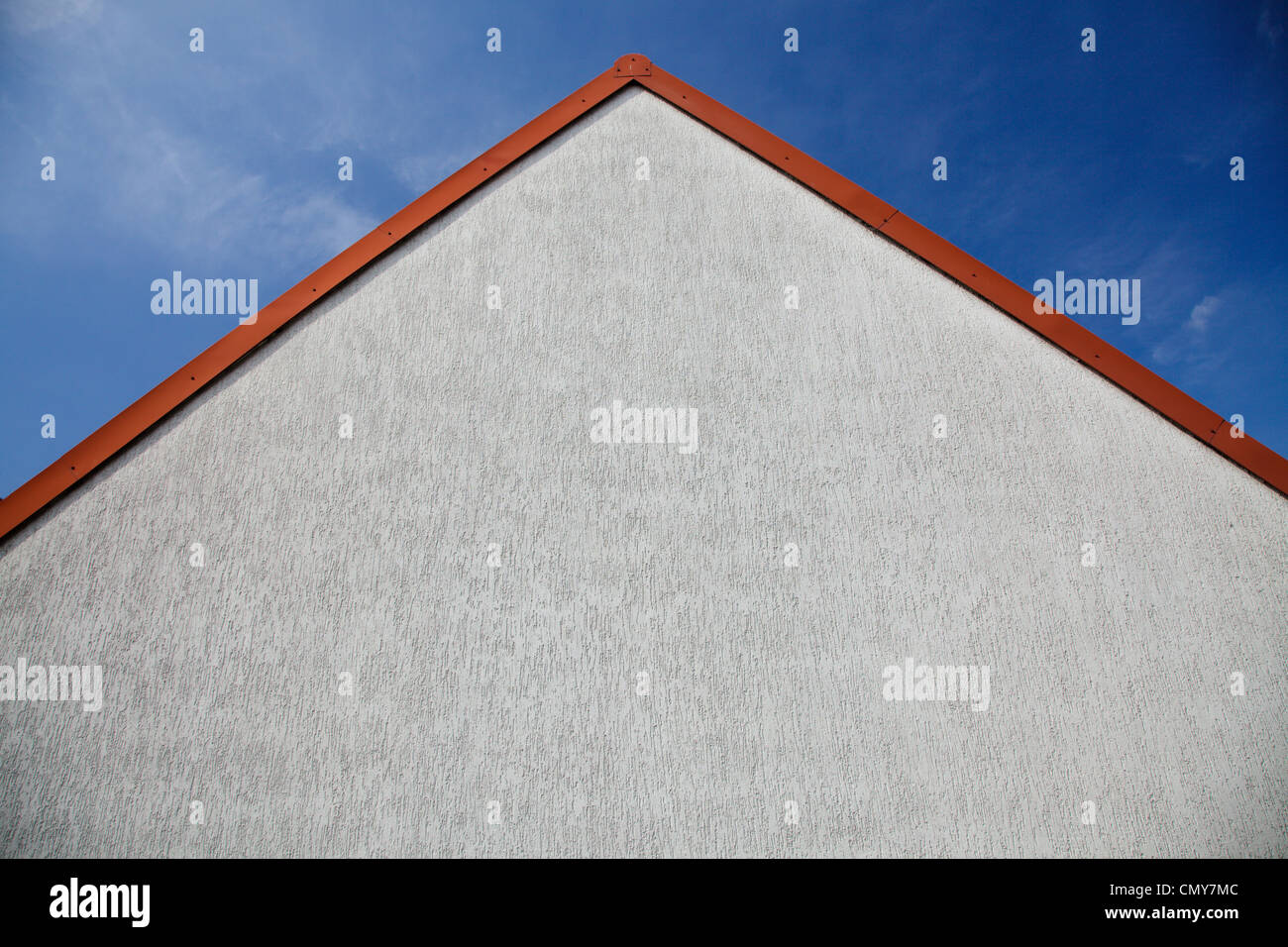 Top of house against blue sky Stock Photo - Alamy