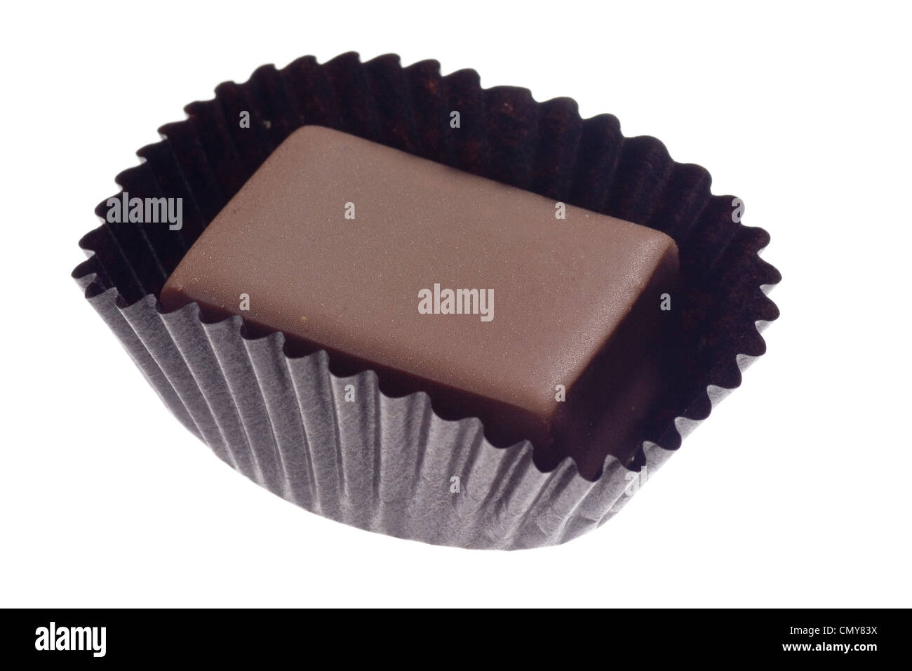 Chocolate in a wrapper isolated on white background Stock Photo - Alamy