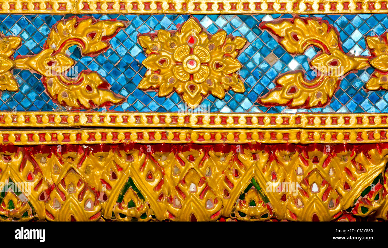 Native art carved on the wall in the temple Stock Photo - Alamy