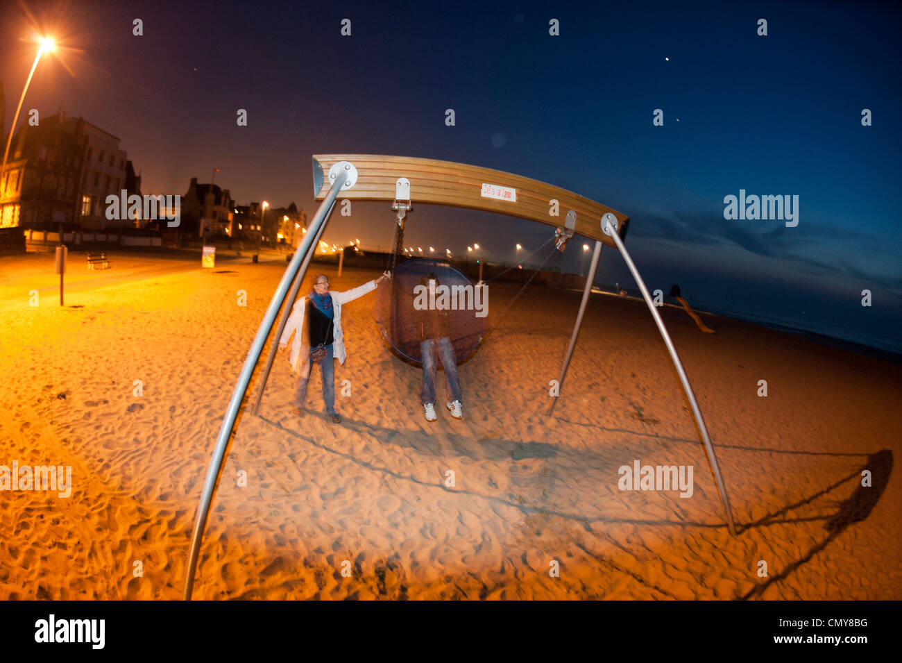 Trouville, France, teeter seesaw see-saw swing at dusk Stock Photo - Alamy