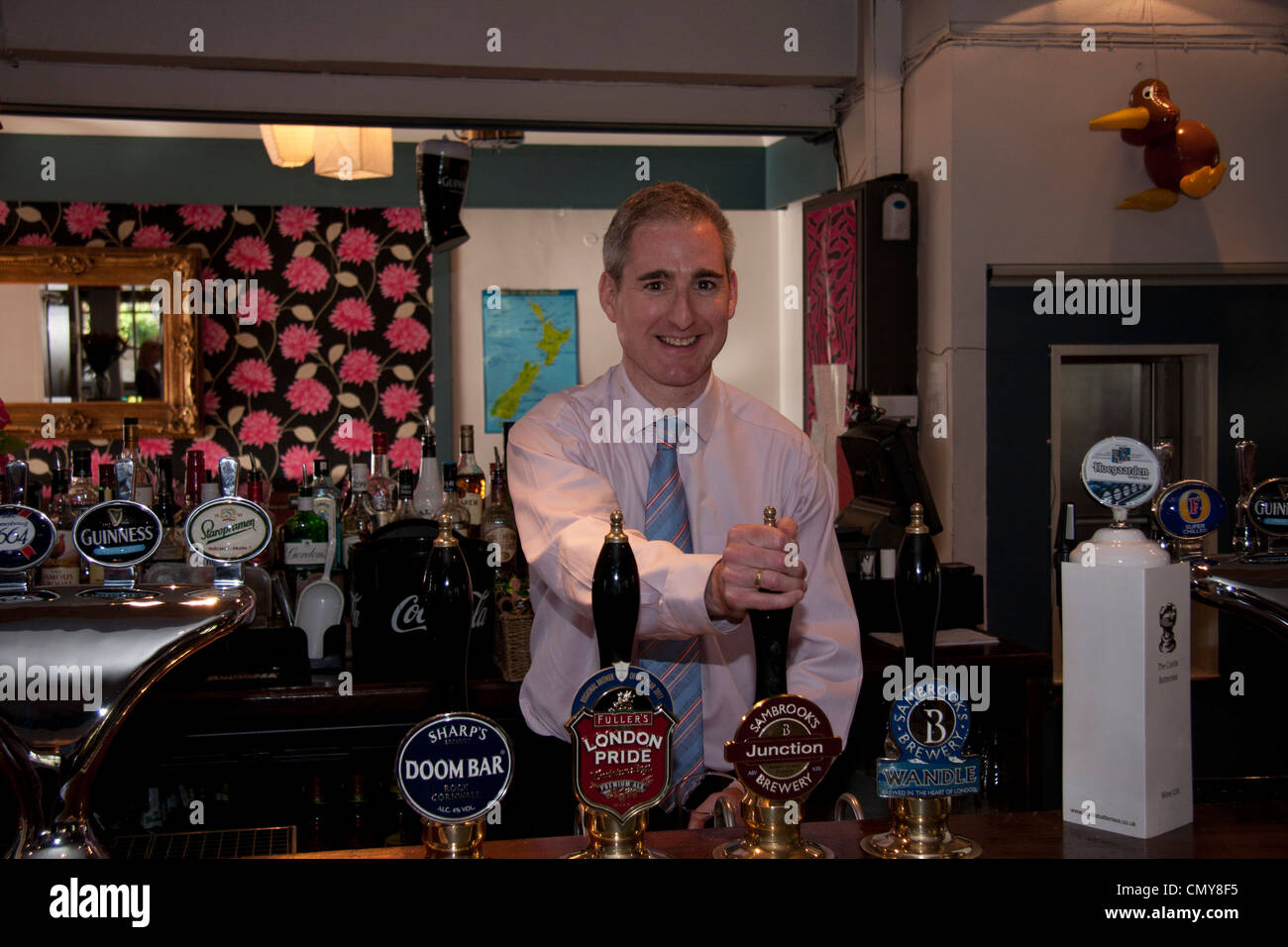Greg Mullholland MP , pulling a pint of local beer Stock Photo - Alamy