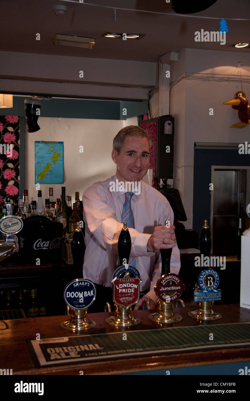 Bar man pulling a pint hi-res stock photography and images - Alamy