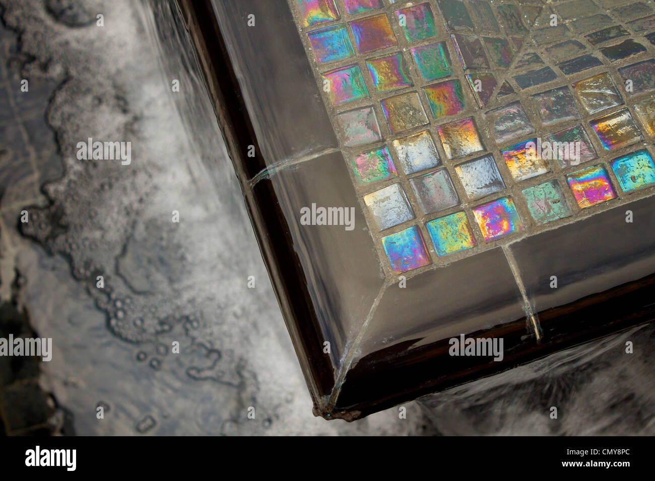 Outdoor fountain finished with multicolor glass tile at Hotel Valencia ...