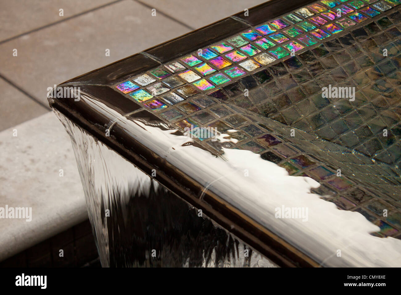 Outdoor fountain finished with multicolor glass tile at Hotel Valencia ...