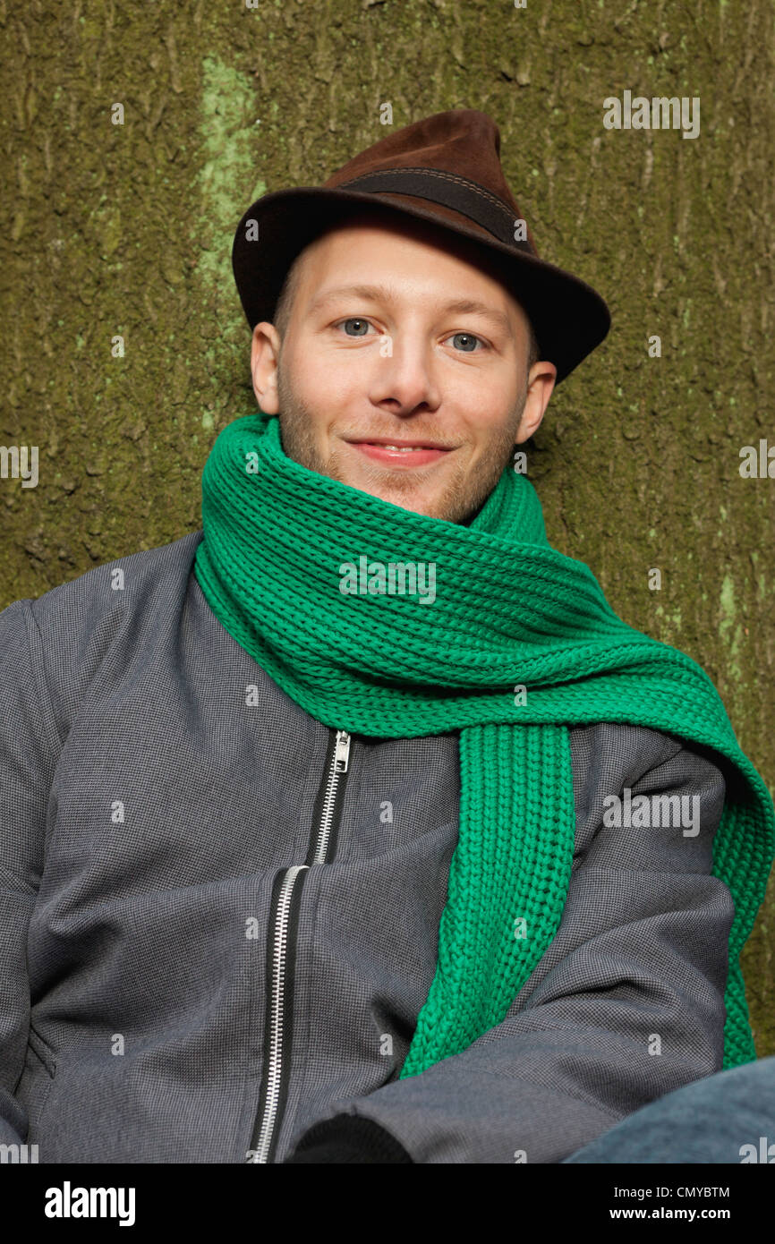 Germany, Berlin, Wandlitz, Young man smiling, portrait Stock Photo - Alamy