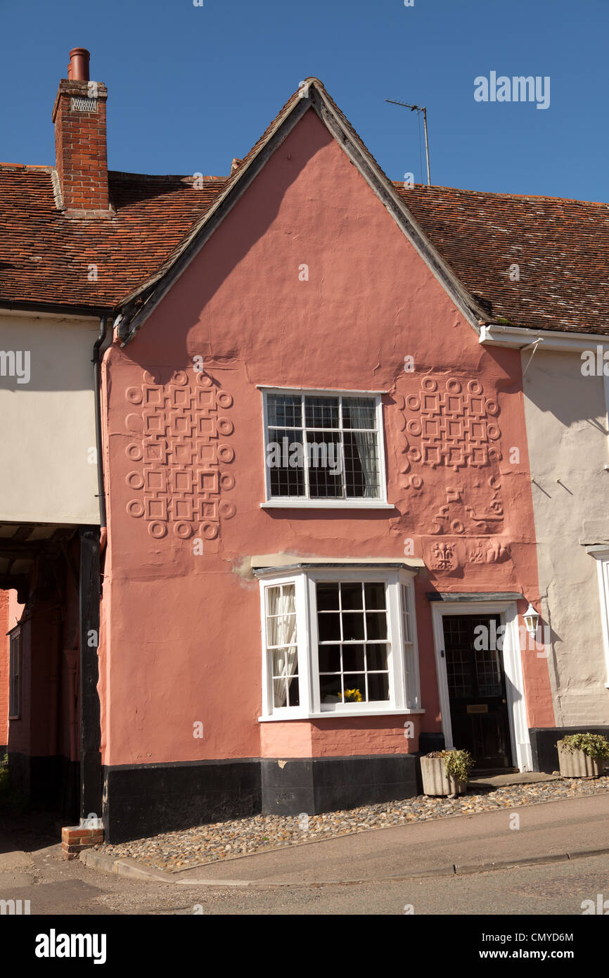 Pink Medieval Tudor building with decorative plasterwork in Lavenham ...