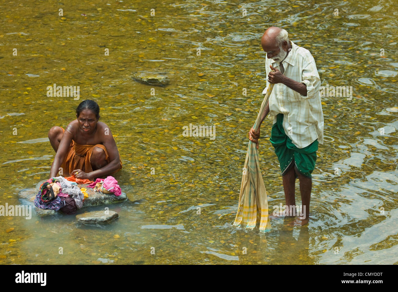 Man & woman washing clothes in Menik Ganga river at this sacred multi ...