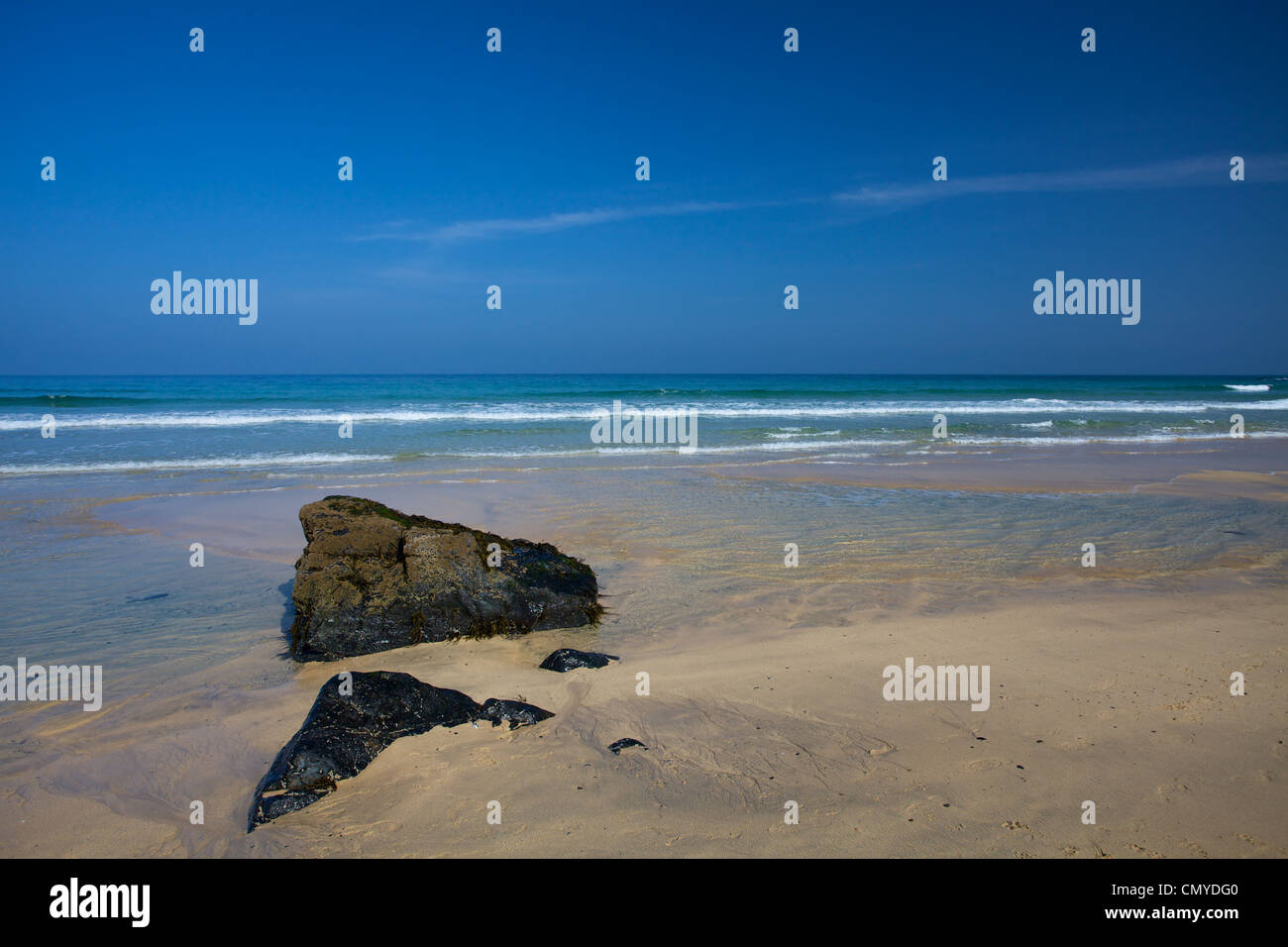 Blue sea, clear sky, and sand at Porthmeor beach in St. Ives, Cornwall ...