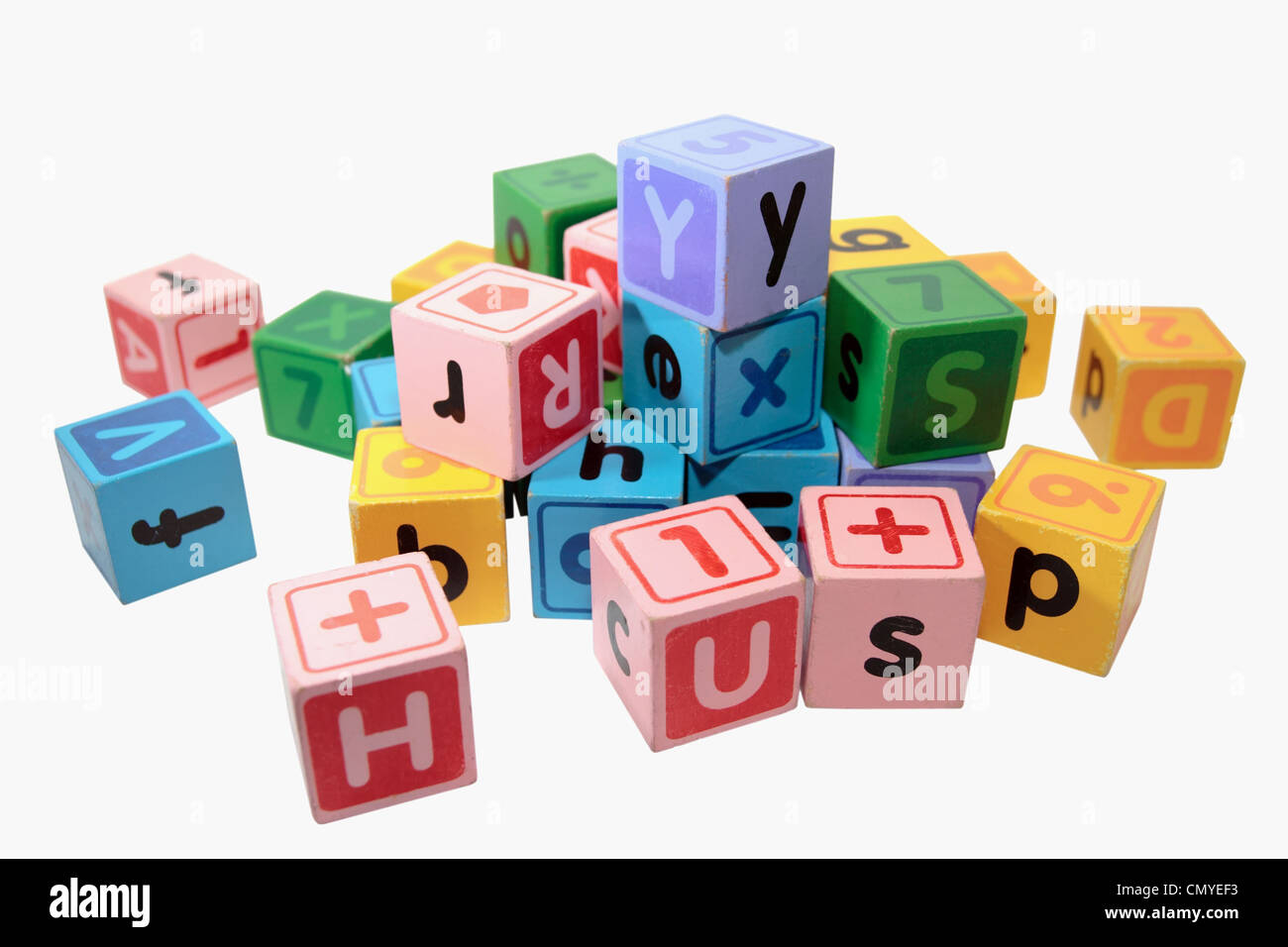 assorted childrens toy letter building blocks against a white ...
