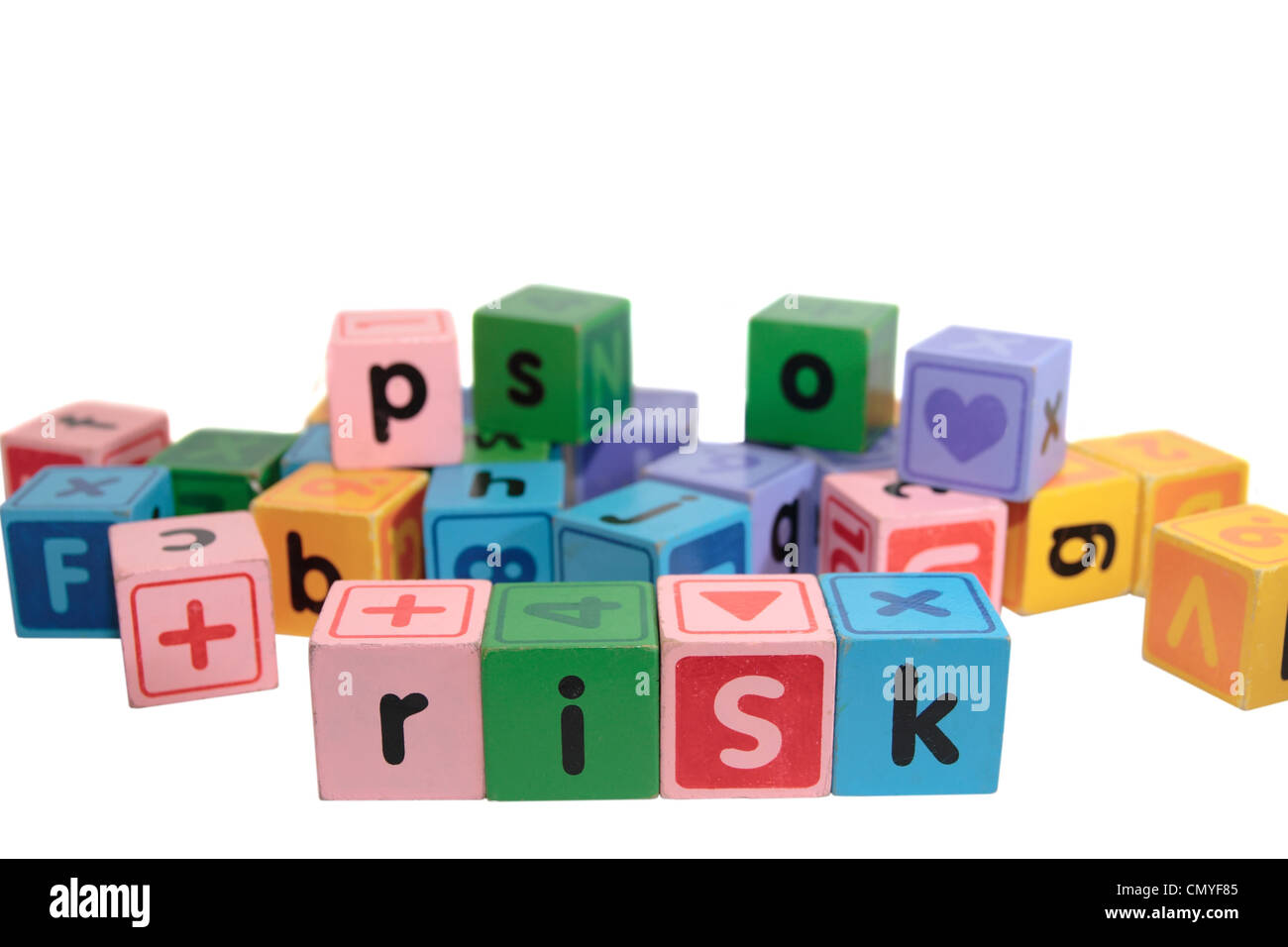 assorted childrens toy letter building blocks against a white ...