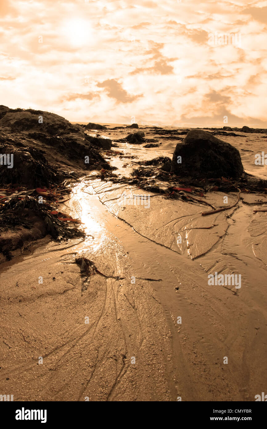 rocks on beale beach co kerry ireland on a red sunset day Stock Photo ...