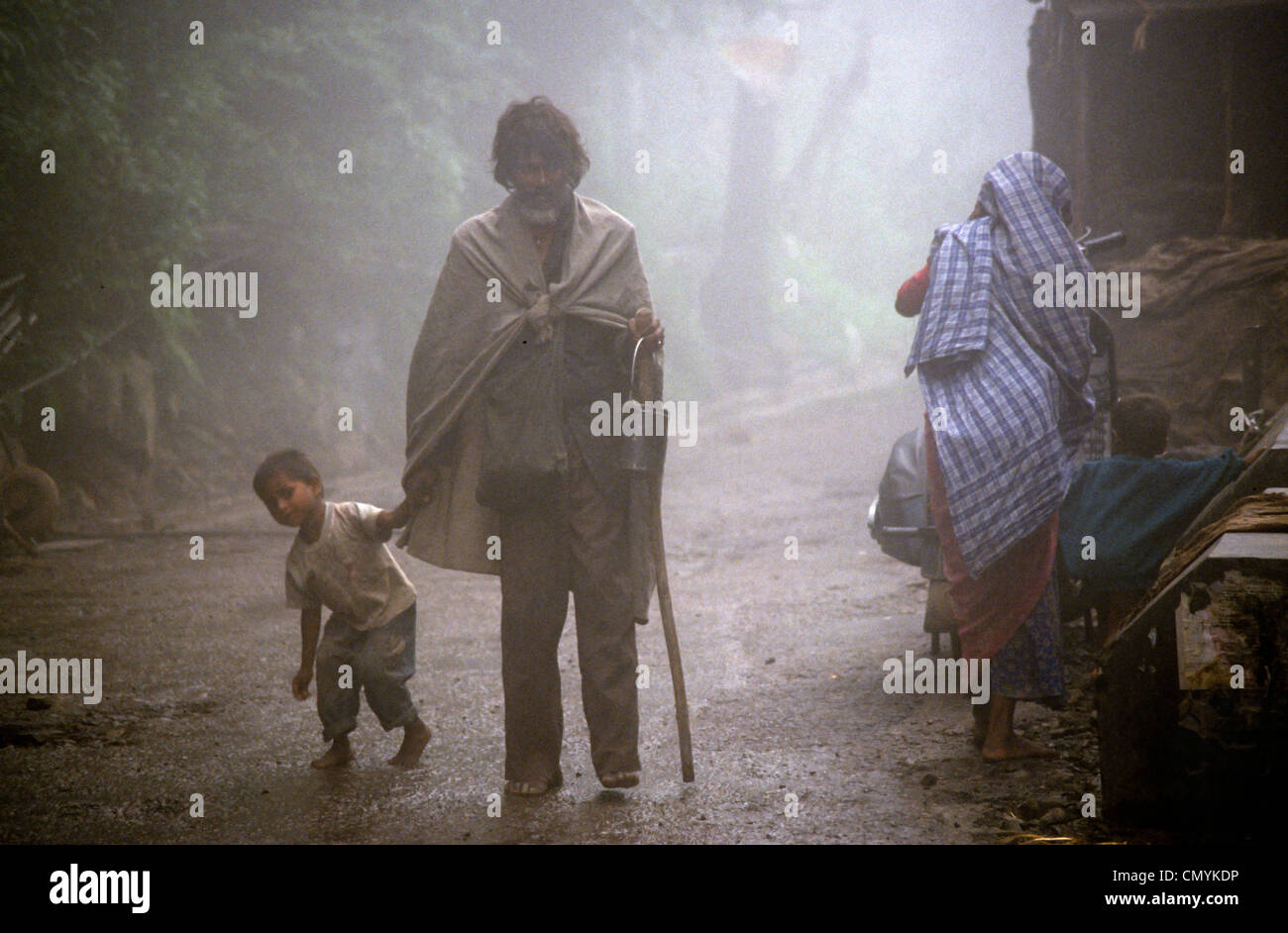 Indian man walking in the rain hi-res stock photography and images - Alamy