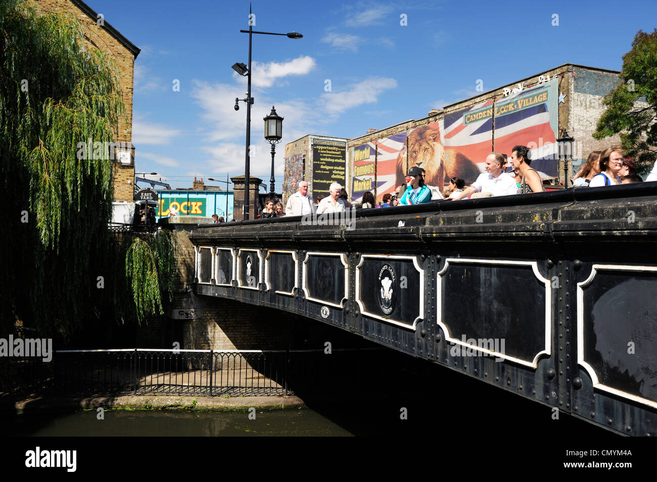 United Kingdom, London, Camden, walkers on the steel bridge near the ...