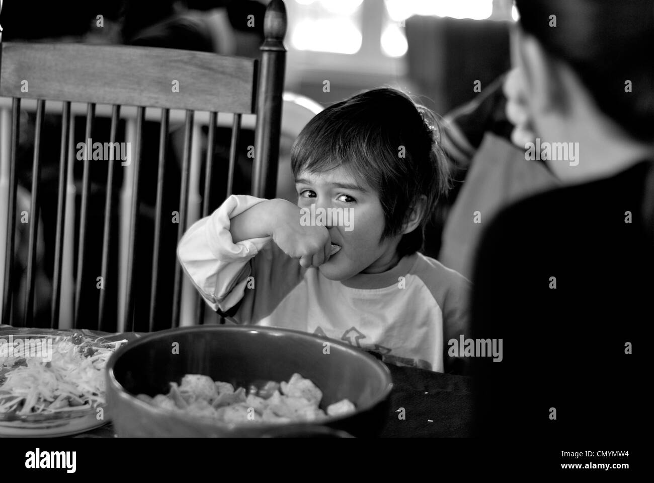 Two people sitting eating Black and White Stock Photos & Images - Alamy
