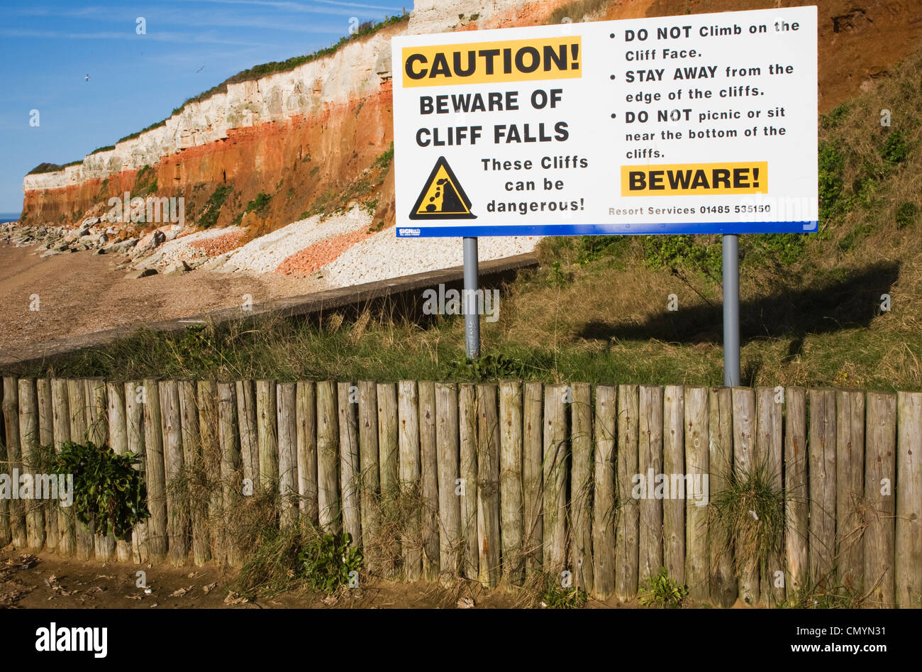 Sign warning of cliff falls at the red and white striped cliffs ...