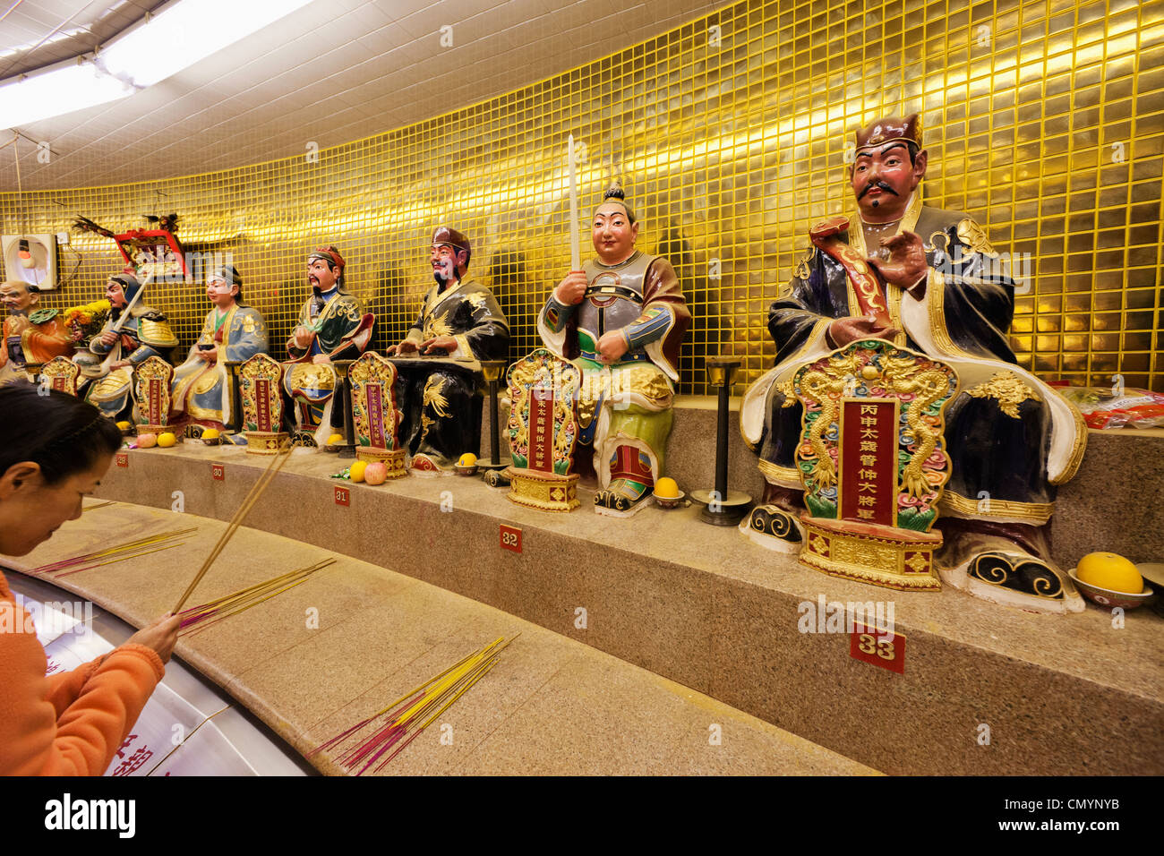 China, Hong Kong, Tsuen Wan, Yuen Yuen Institute, Worshippers Praying ...