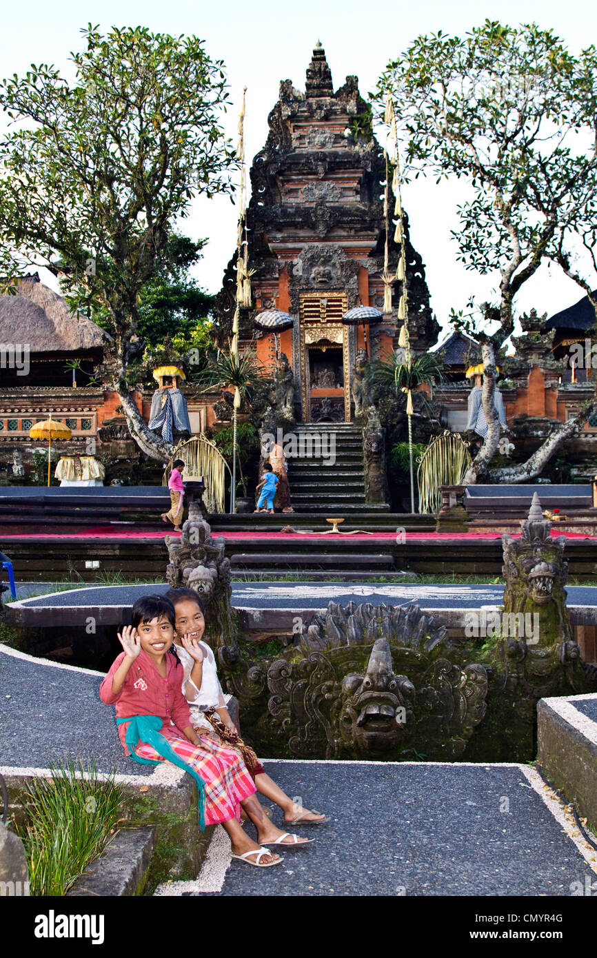 Twi little girl friends at temple in Ubud, Bali Indonesia Stock Photo ...