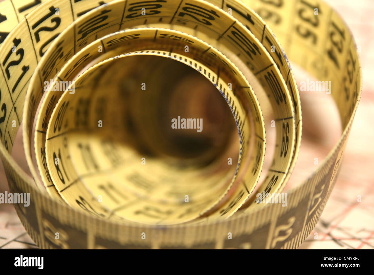 Yellow measure tape Stock Photo - Alamy