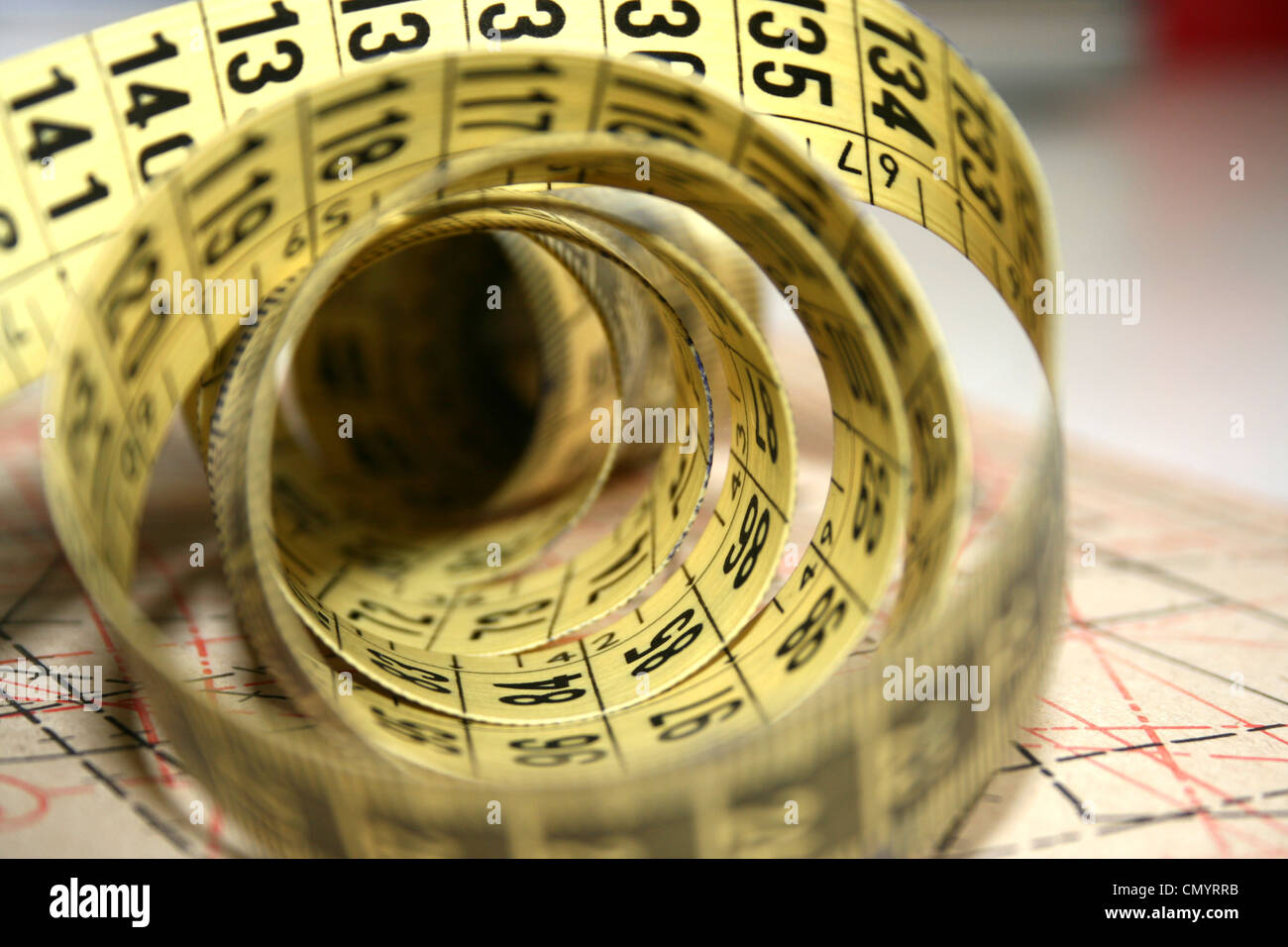 Yellow measure tape Stock Photo - Alamy
