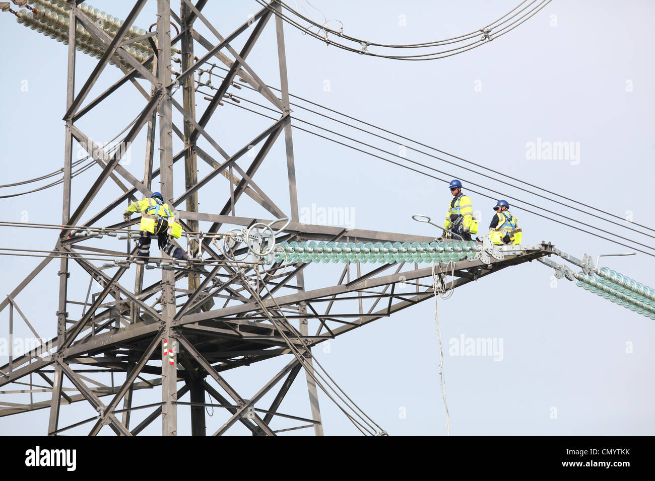 Workers maintain an electricity pylon Stock Photo - Alamy