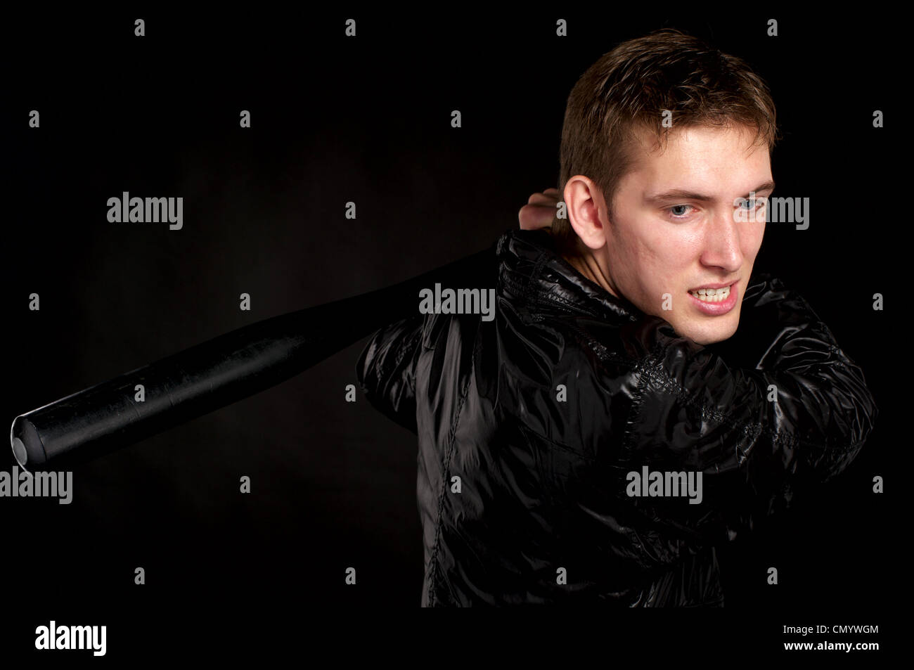 Young man with a baseball bat are ready for fight (over black Stock ...