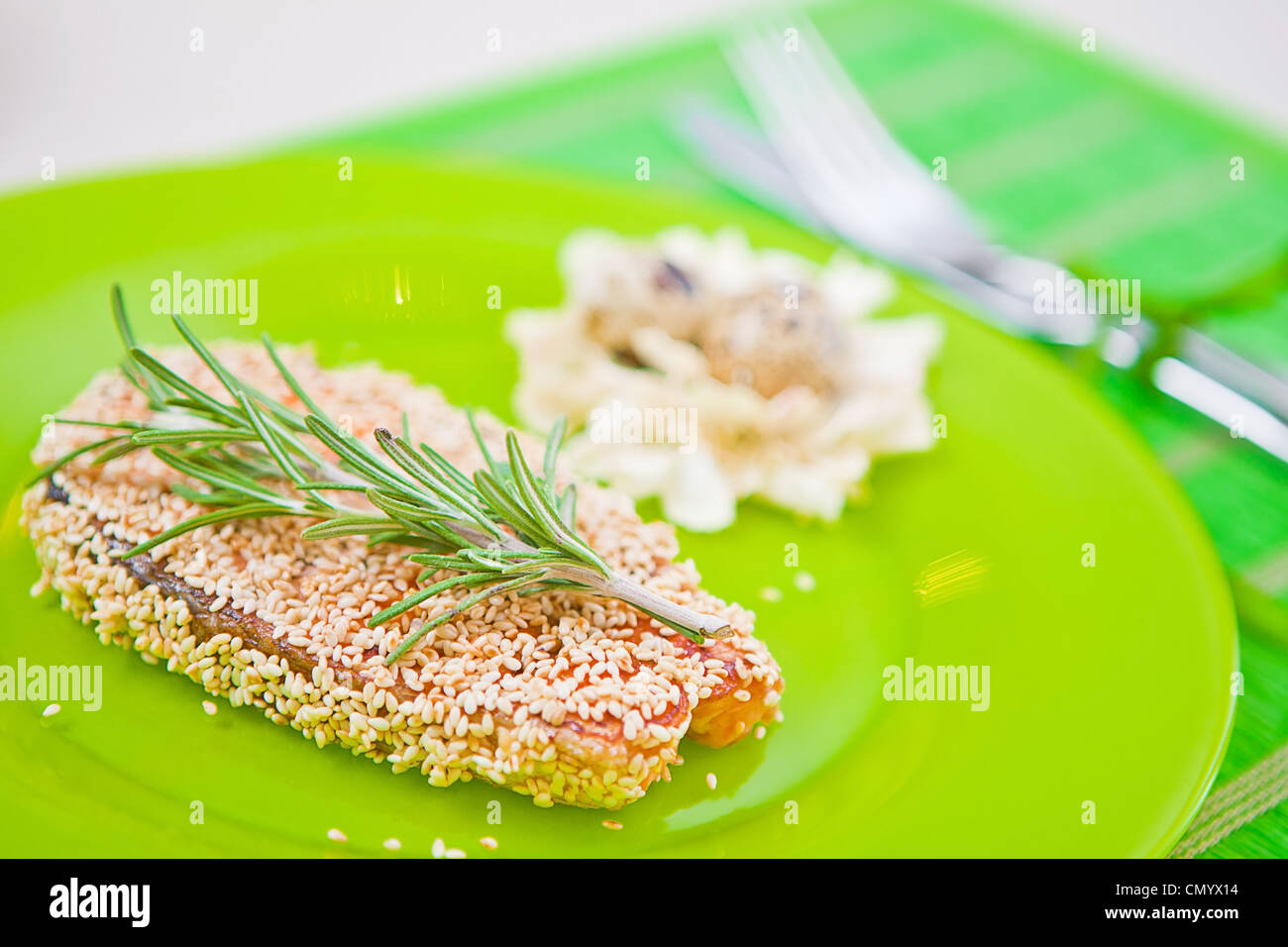 fish with sesame on a green plate Stock Photo - Alamy