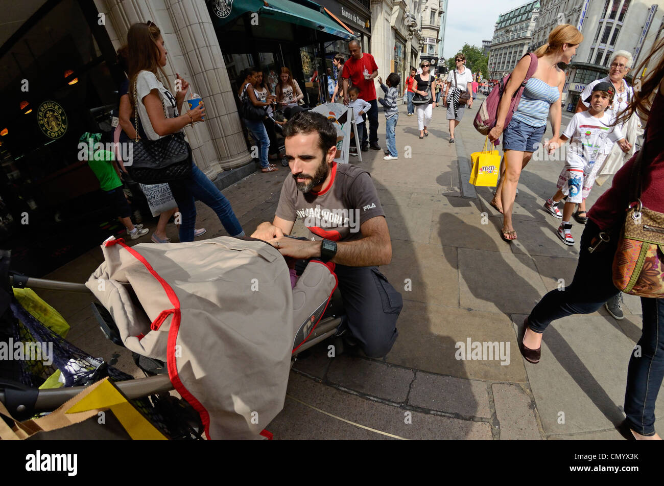 London, England. Man with pushchair in Regent Street Stock Photo - Alamy