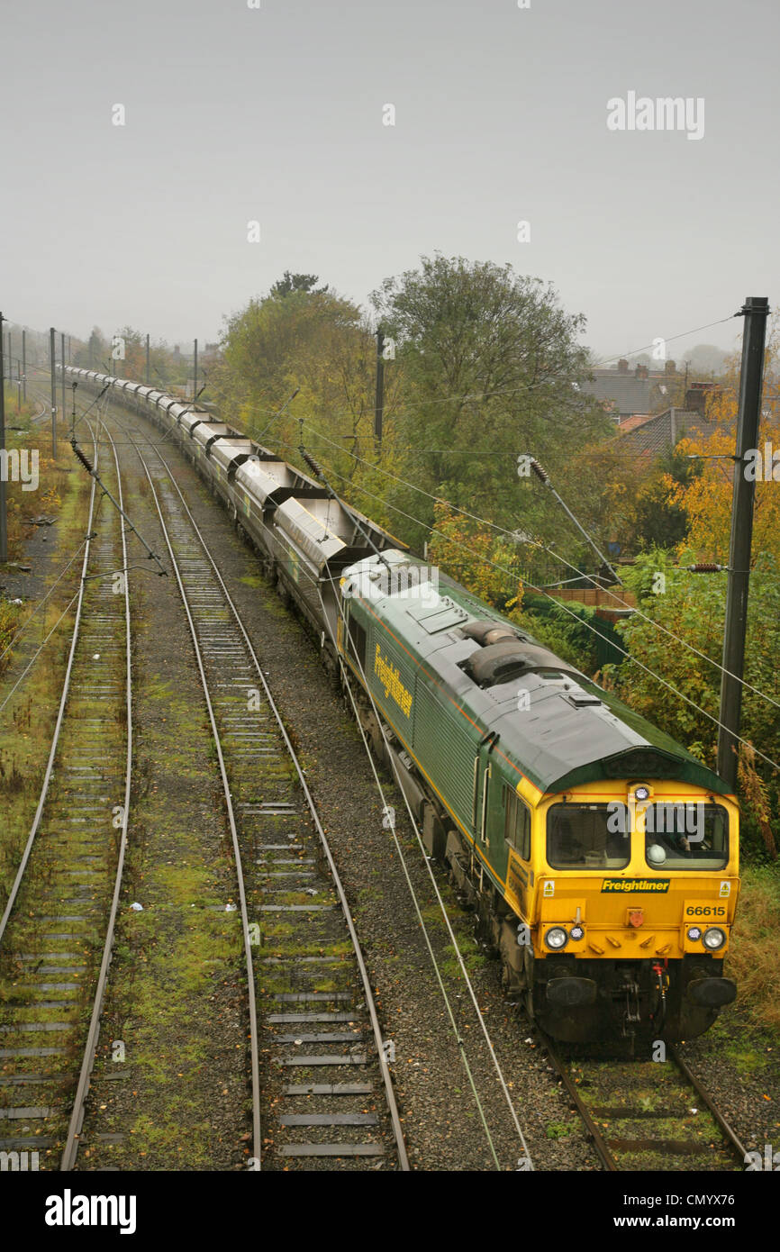 Class 66 diesel locomotive 66615 with train of empty coal wagons ...